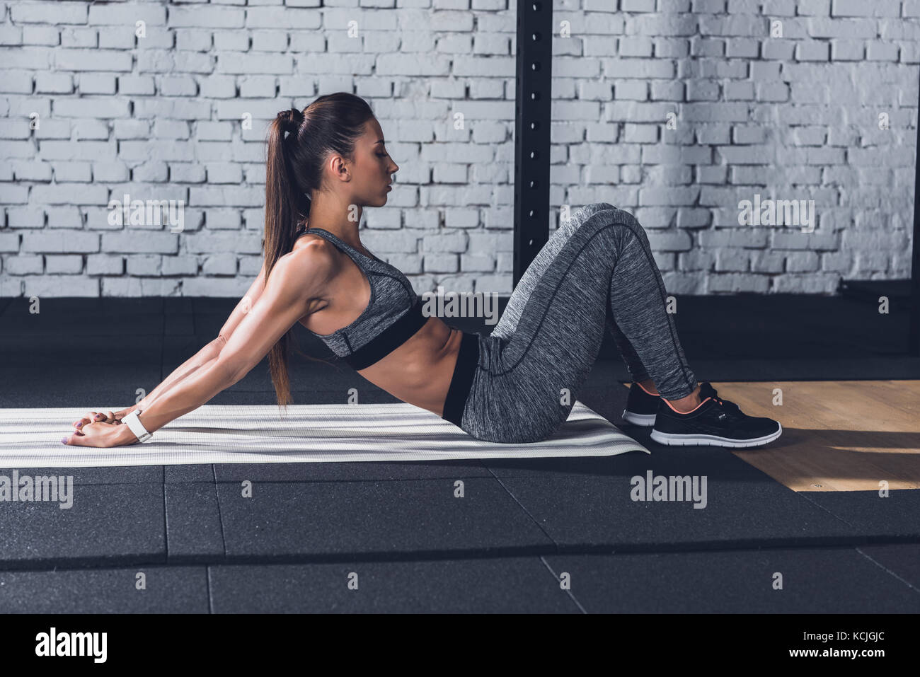 Woman stretching on mat hi-res stock photography and images - Alamy