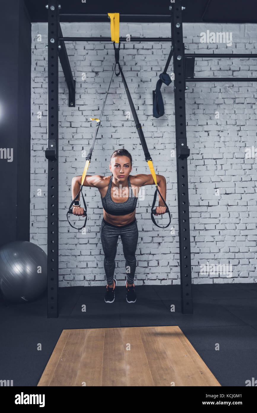 woman doing TRX Suspension Training Stock Photo - Alamy