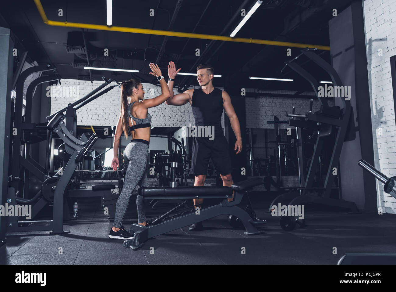 Beautiful sporty couple high five hi-res stock photography and images ...