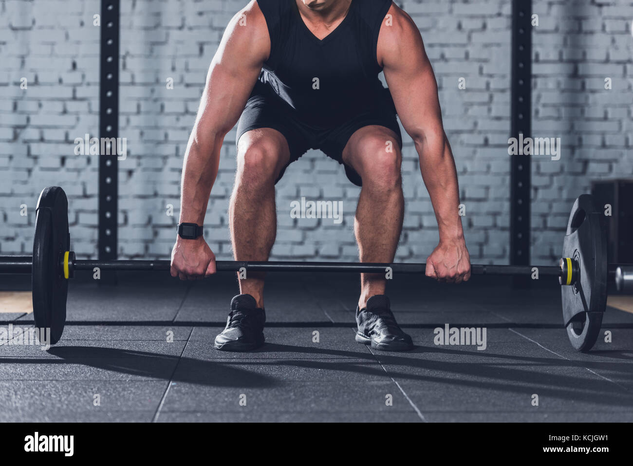 man lifting barbell Stock Photo - Alamy