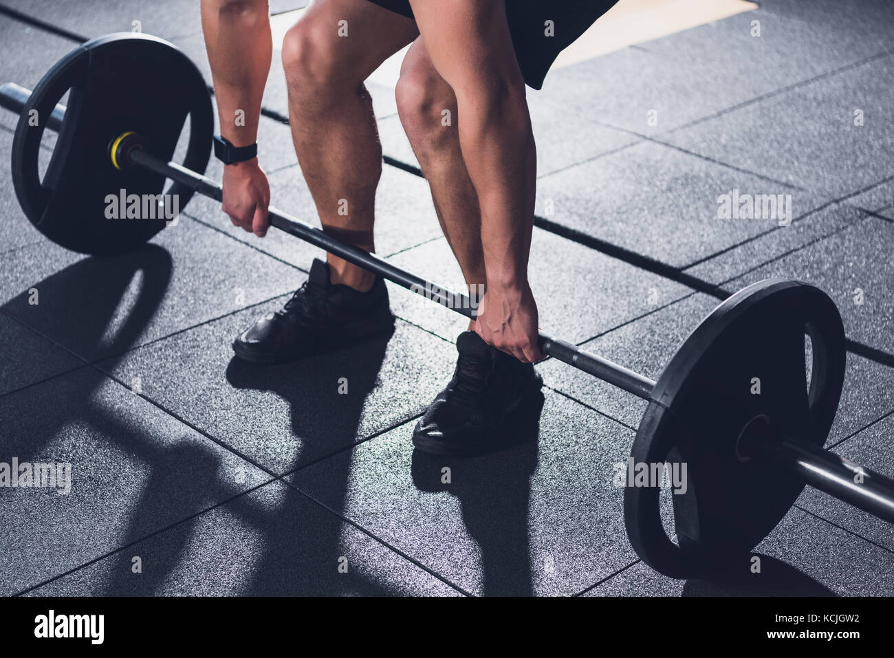 man lifting barbell Stock Photo - Alamy