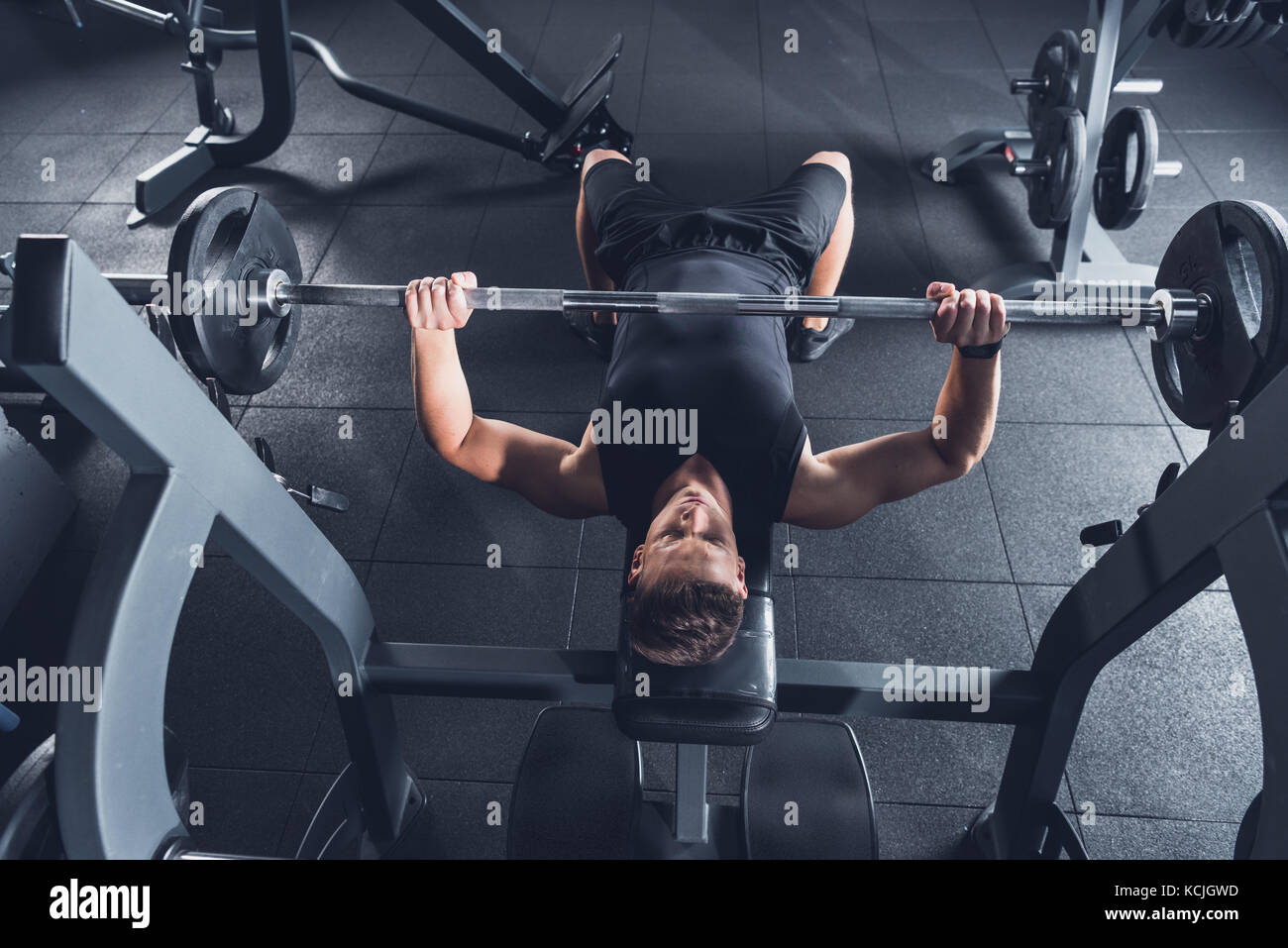 man lifting barbell Stock Photo - Alamy