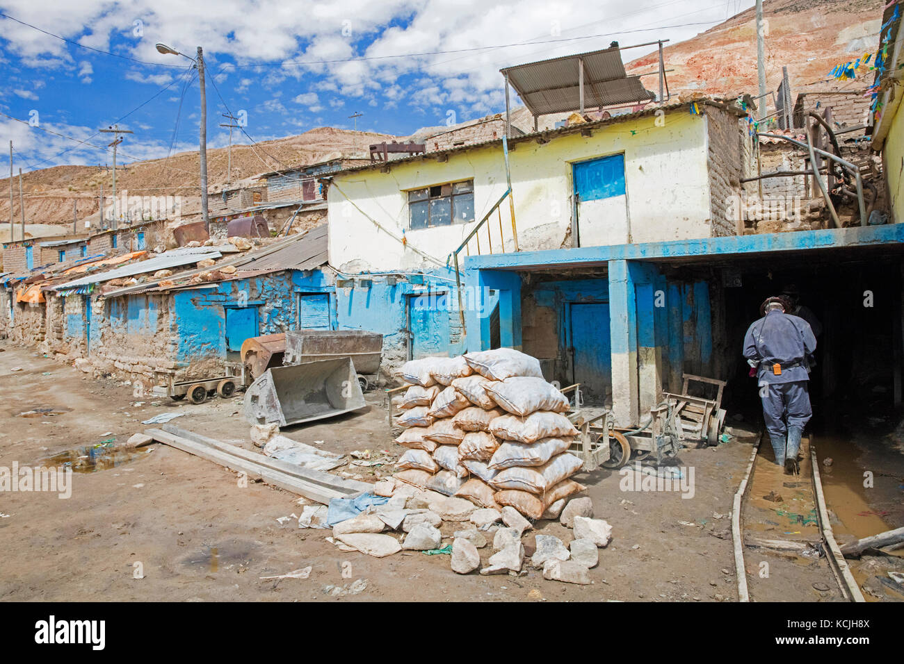Tourists with guide entering silver mine on the Cerro Rico de Potosi ...