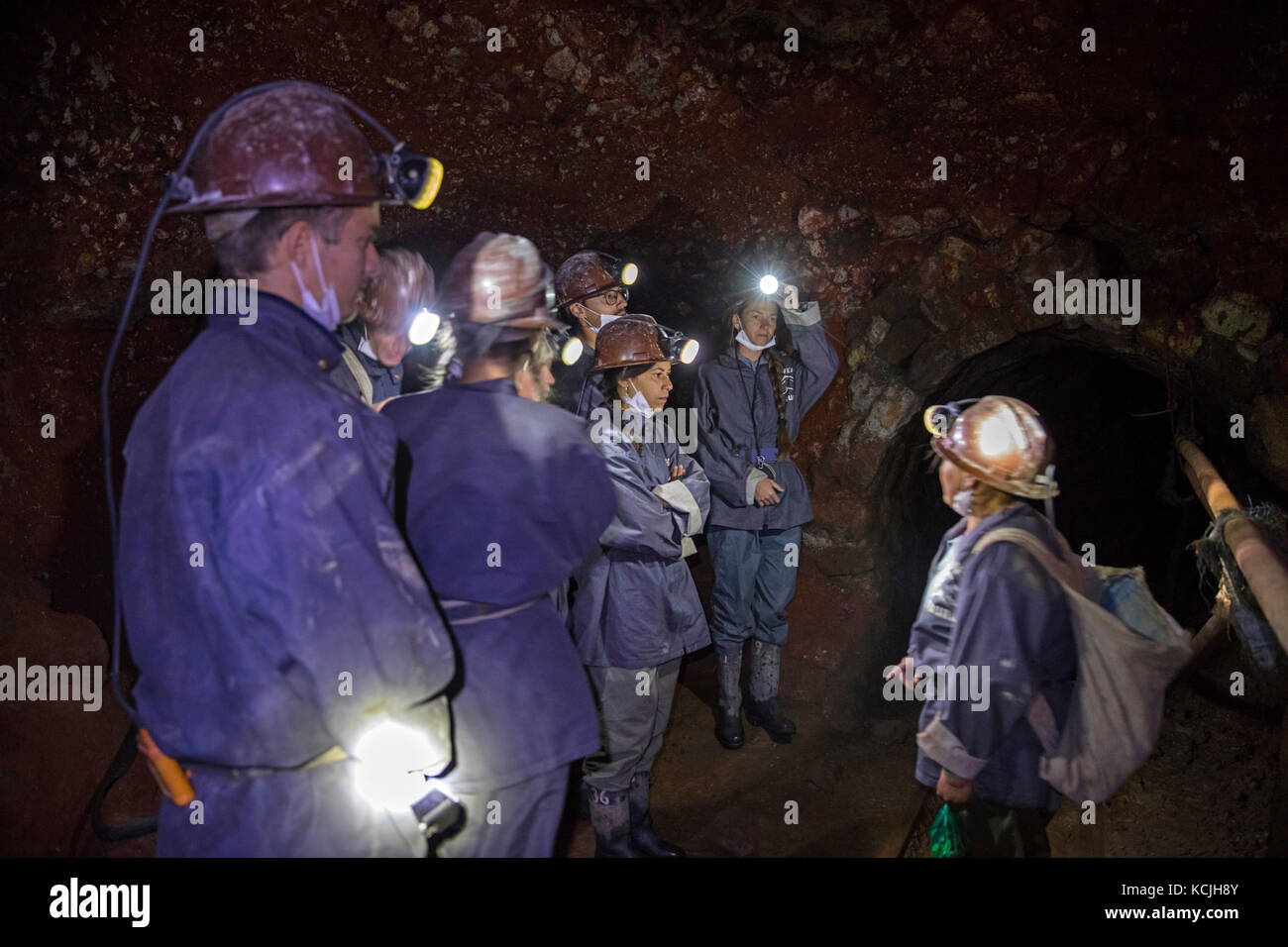 Tourists with guide visiting silver mine on the Cerro Rico de Potosi ...