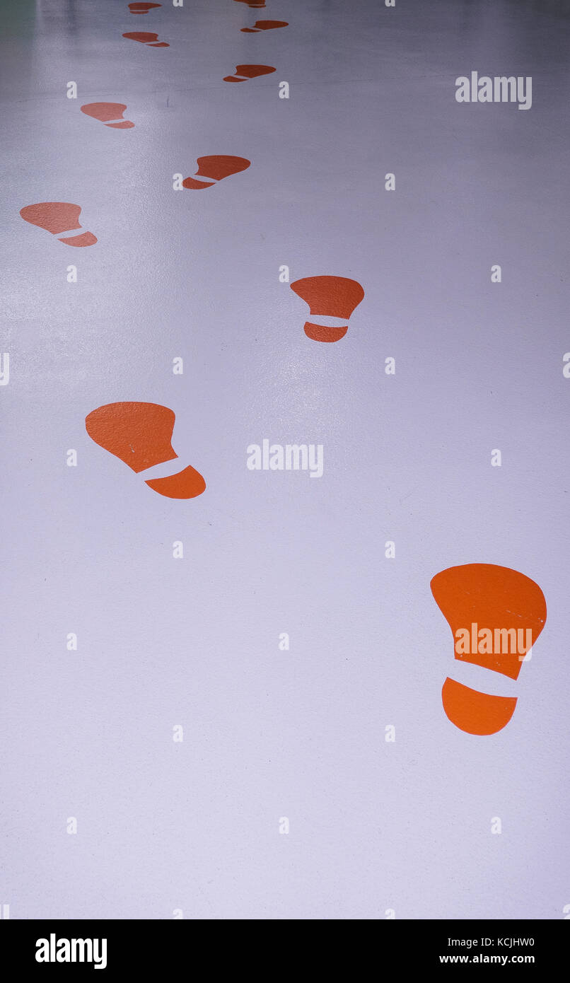 Footsteps in orange color Stock Photo - Alamy