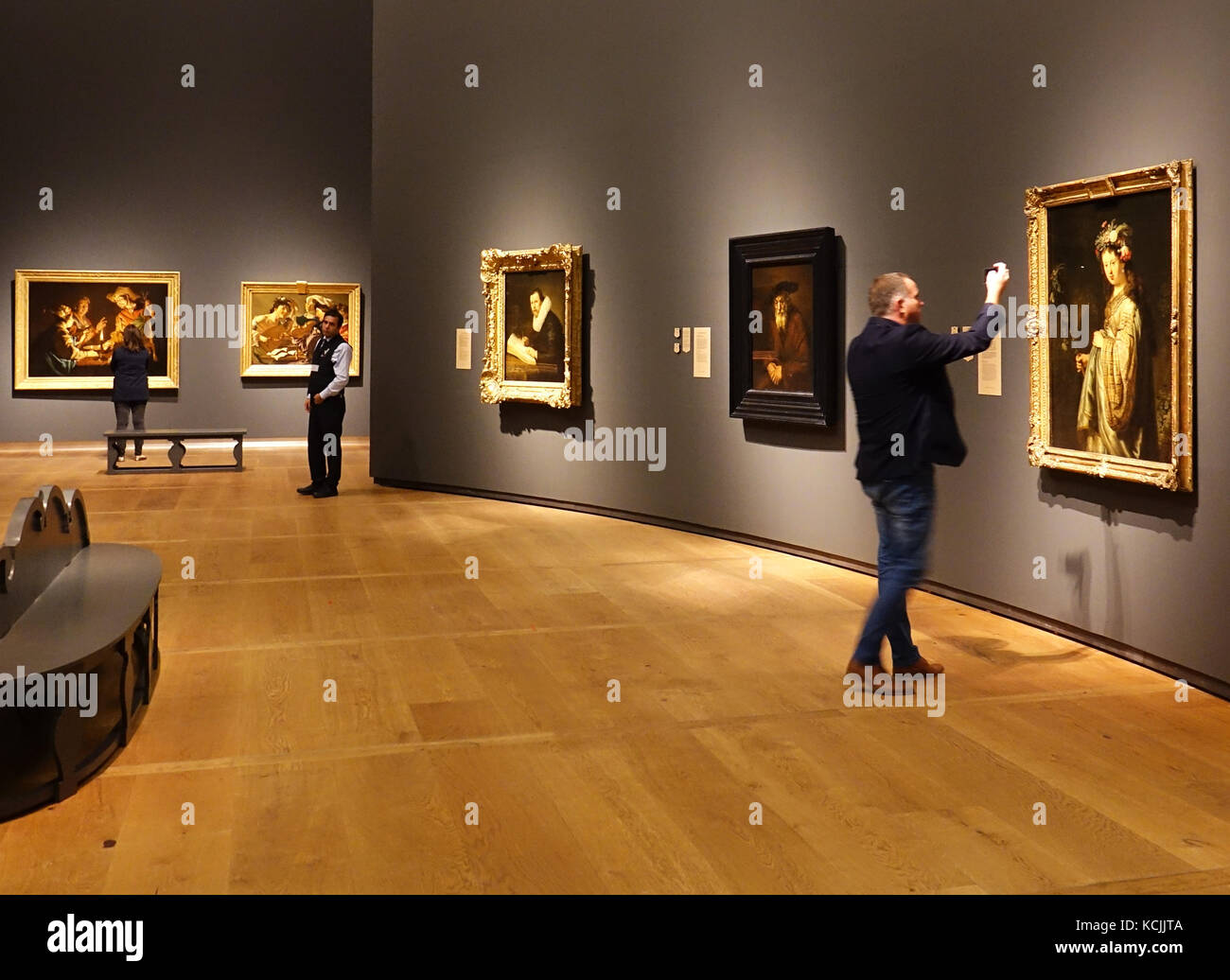 Visitors look at paintings at the exhibition 'Dutch Masters from the ...