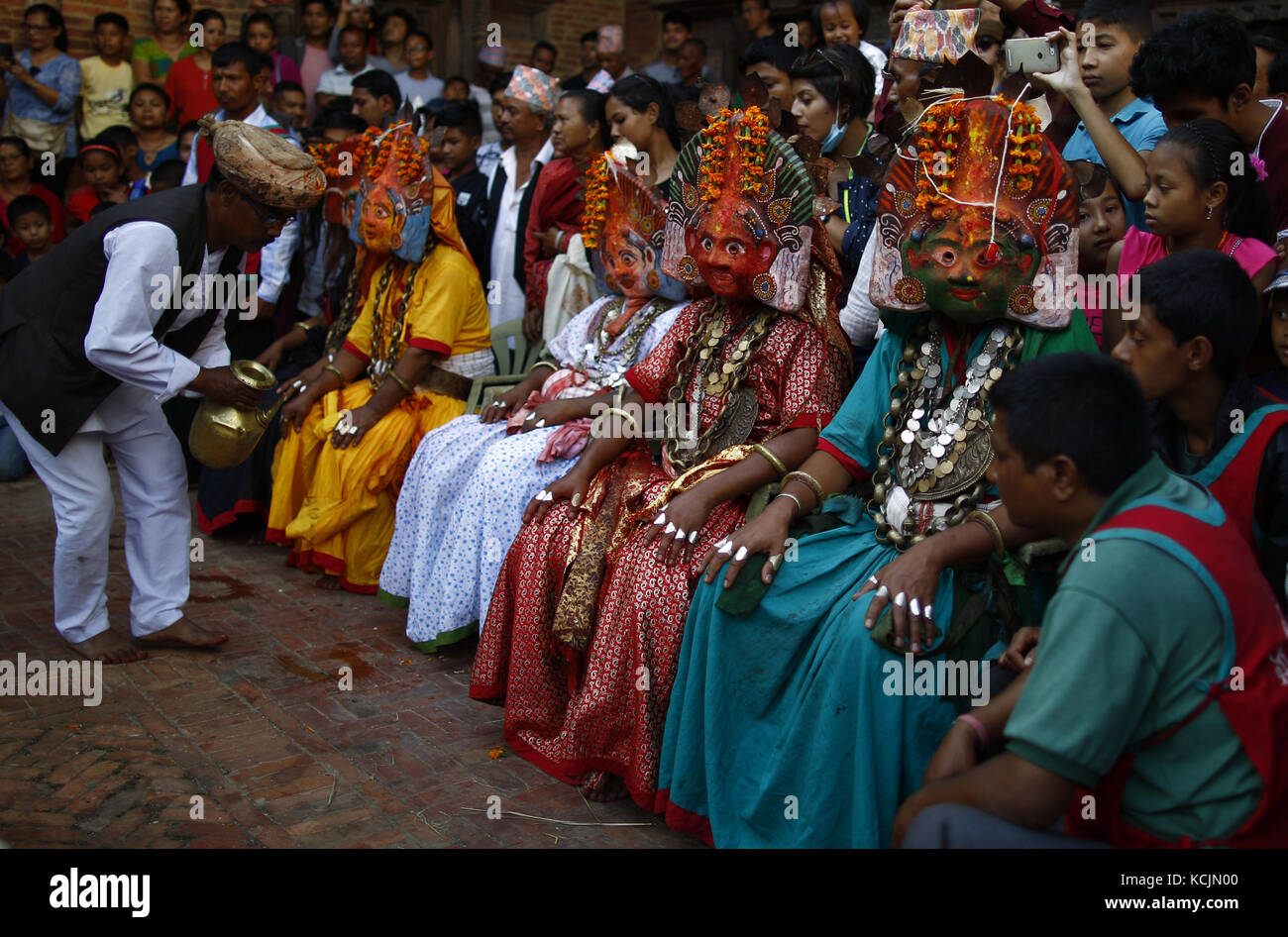 Lalitpur, Nepal. 5th Oct, 2017. A priest performs rituals as Nepalese ...