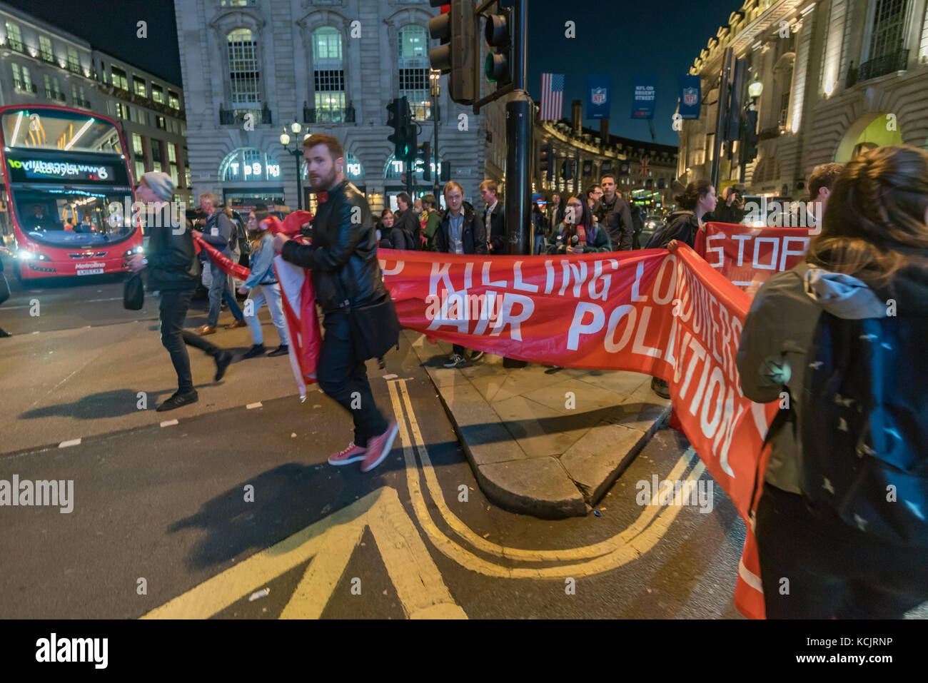 London, UK. 5th October 2017. Campaigners walk into the road with ...