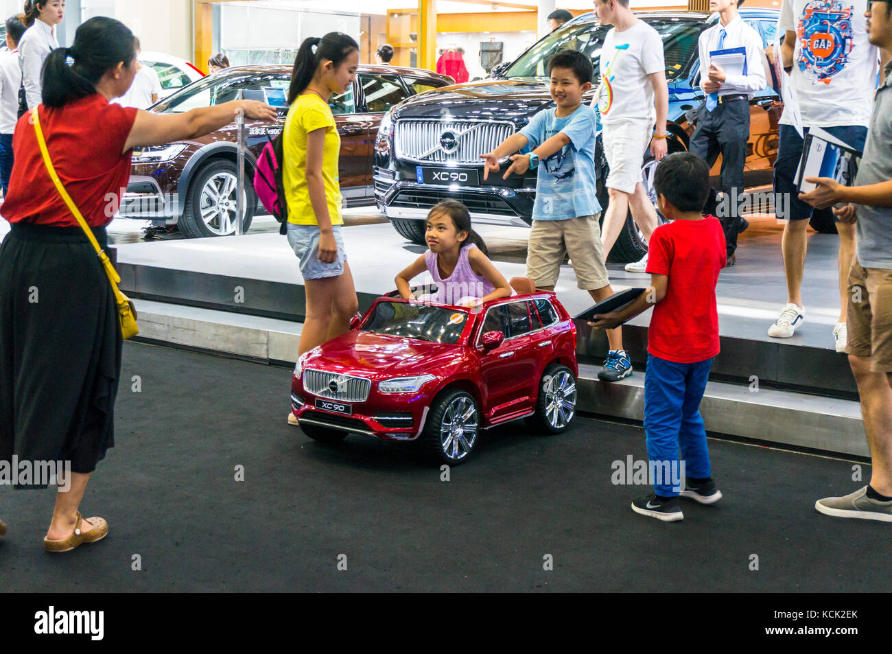 Kids posing with mini Volvo car at 2017 Shenzhen Auto Show Stock Photo ...