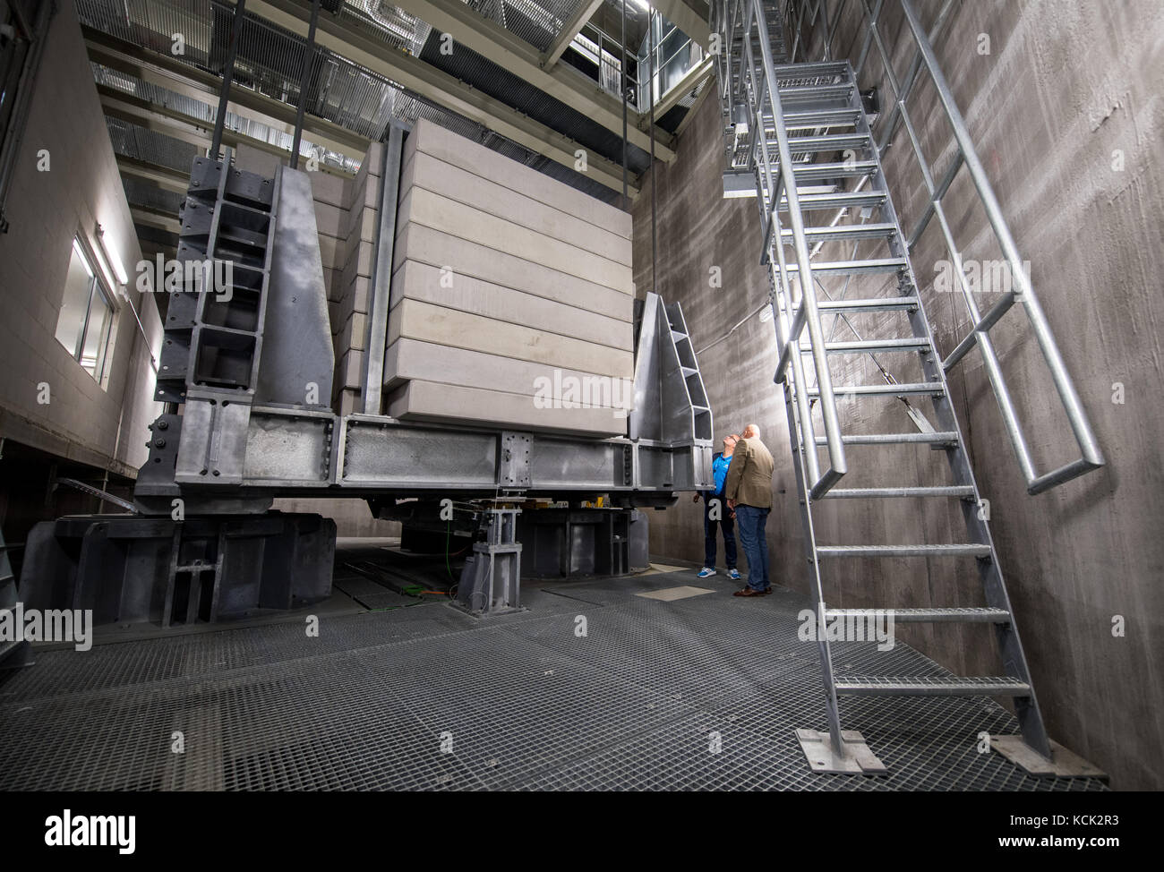 A visitor and a Thyssenkrupp Elevators employee standing next to the ...