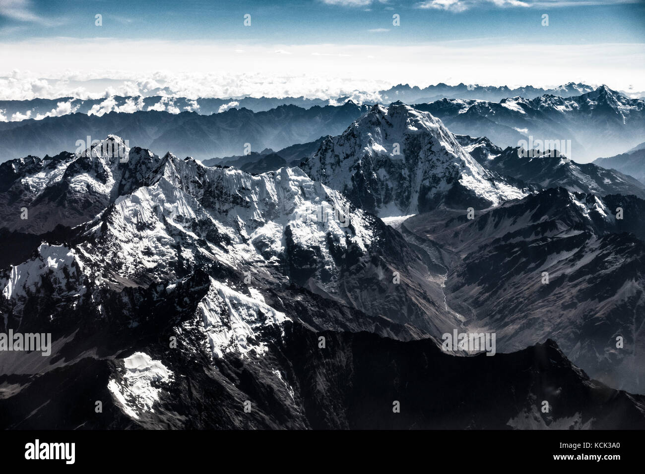 An aerial view of the snow capped Peruvian Andes, shot from an airplane ...