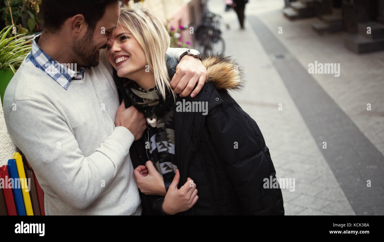 Romantic young happy couple kissing and hugging Stock Photo - Alamy