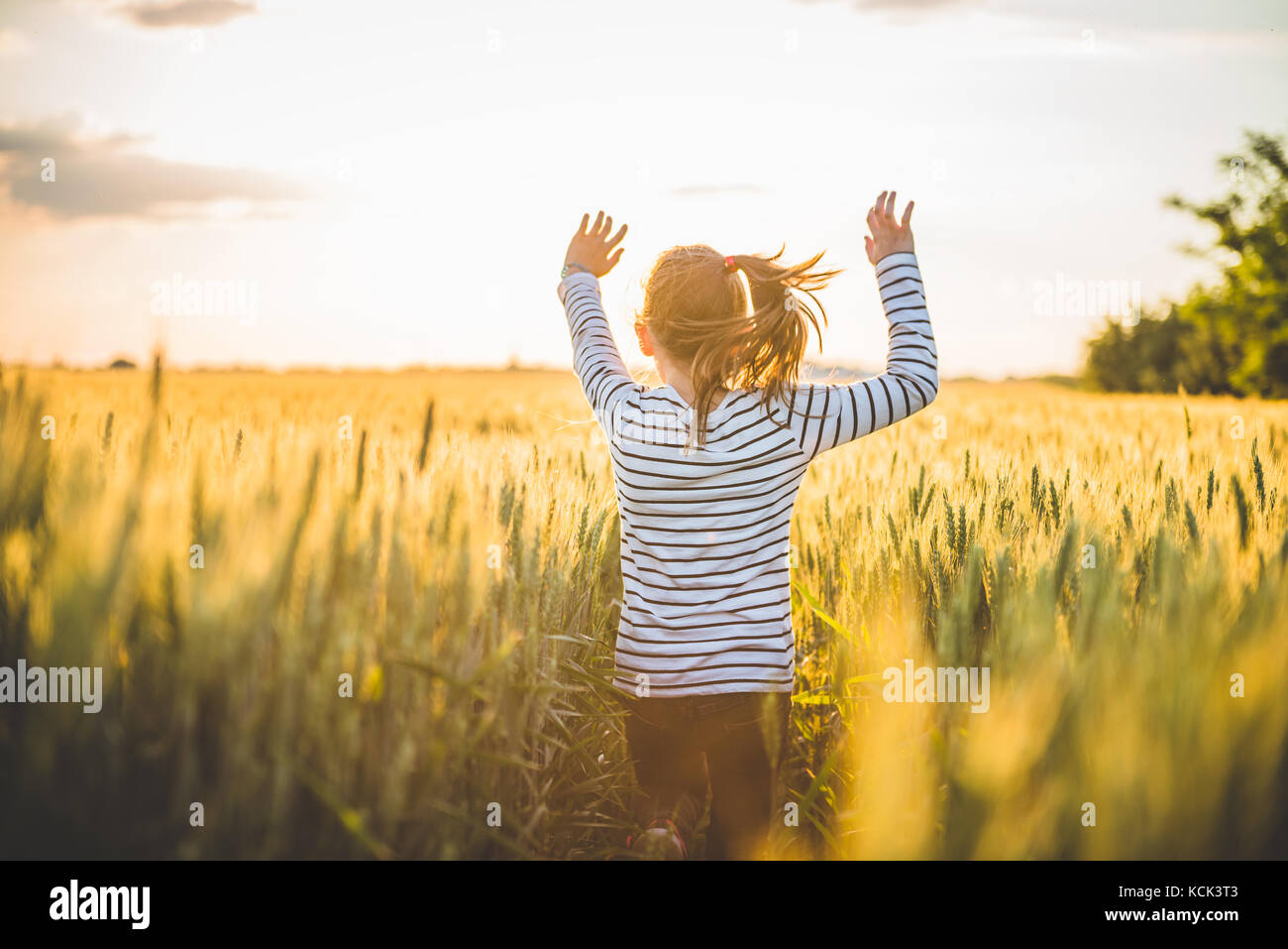 Girl running in field hi-res stock photography and images - Alamy
