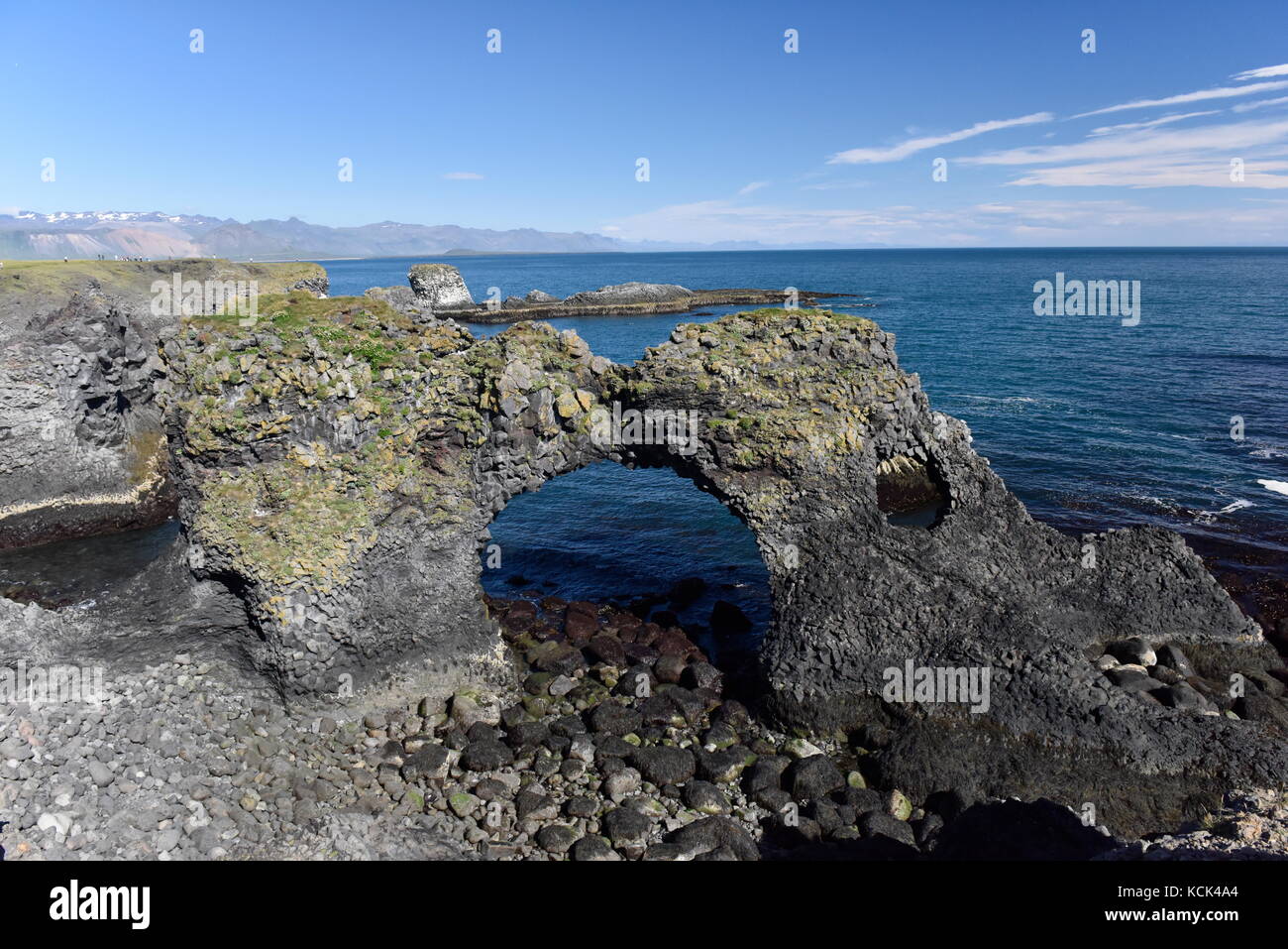 Shoreline and cliffs of basalt rock at Arnarstapi nature reserve seen ...