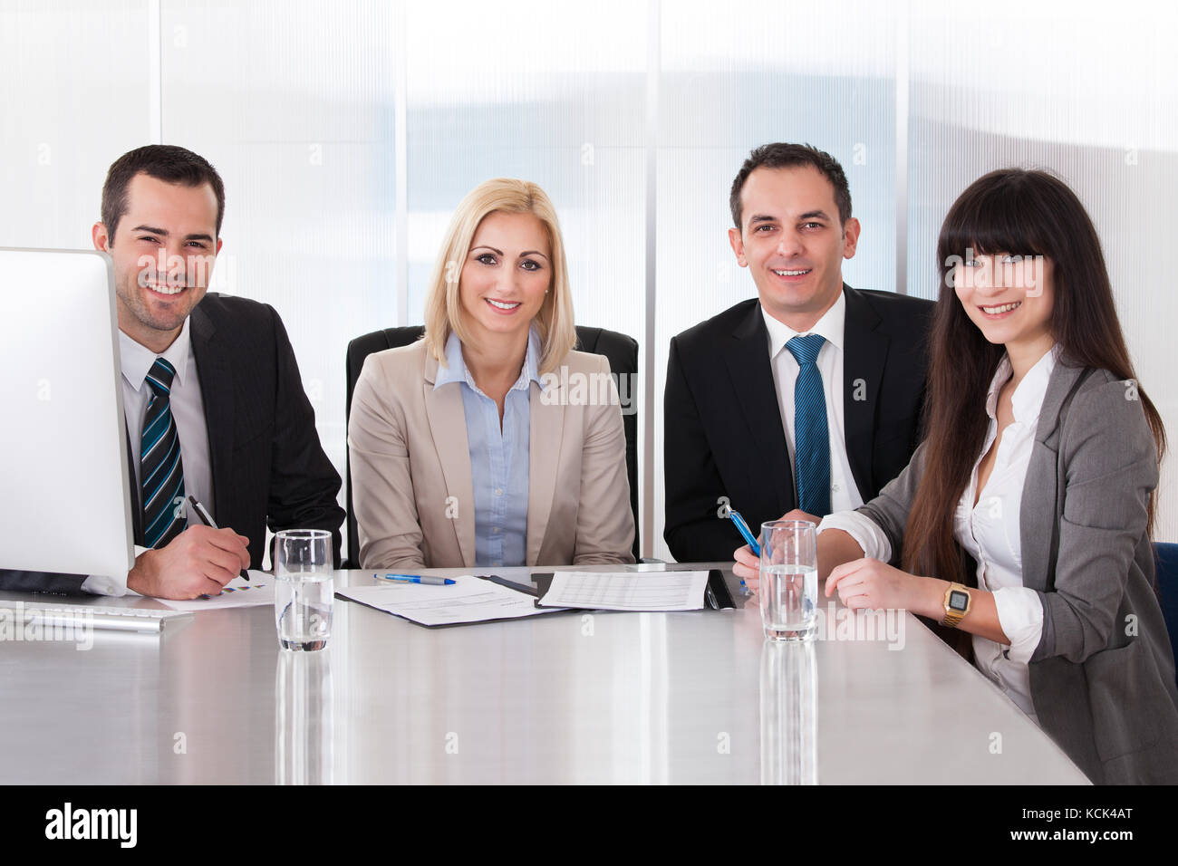 Happy Business Team In Office At The Meeting Stock Photo - Alamy