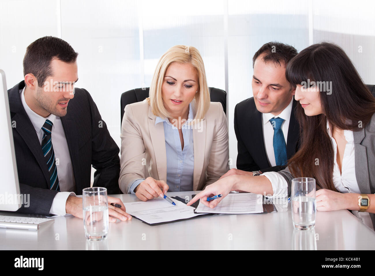 Happy Business Team In Office At The Meeting Stock Photo - Alamy
