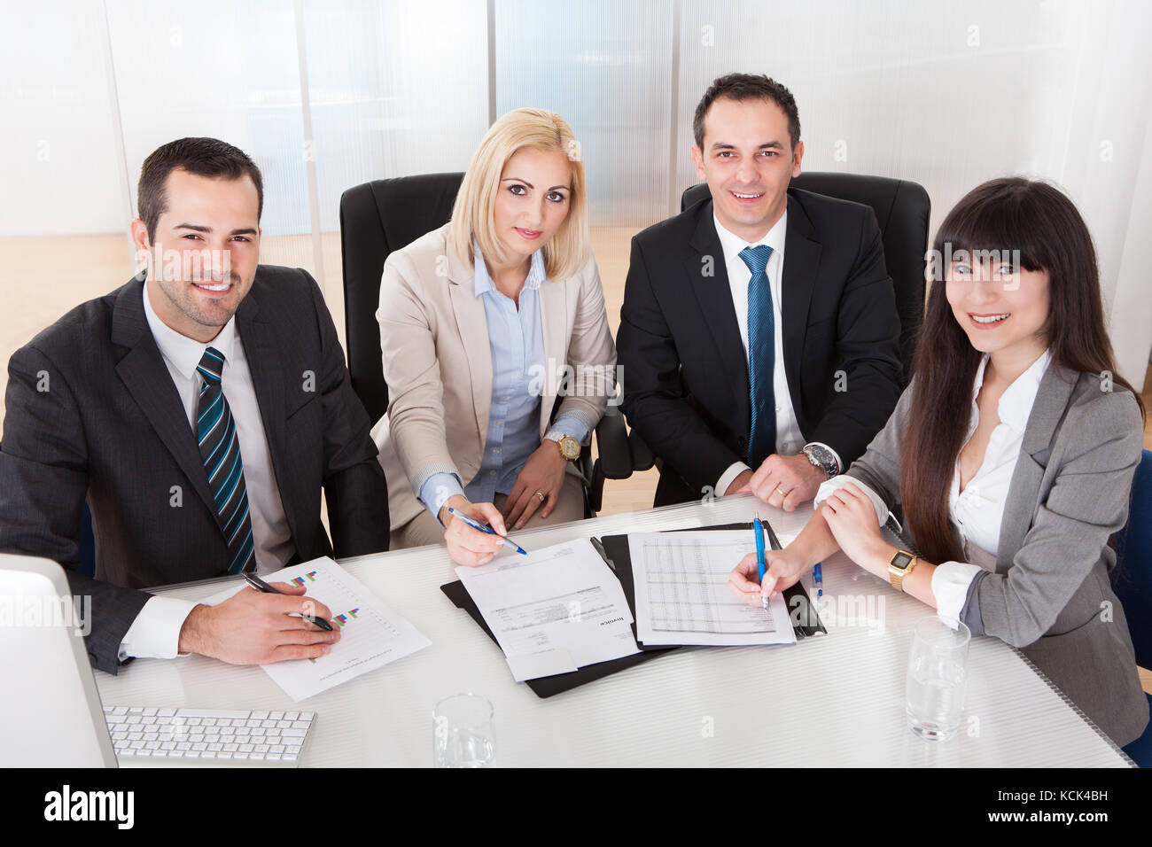 Happy Business Team In Office At The Meeting Stock Photo - Alamy