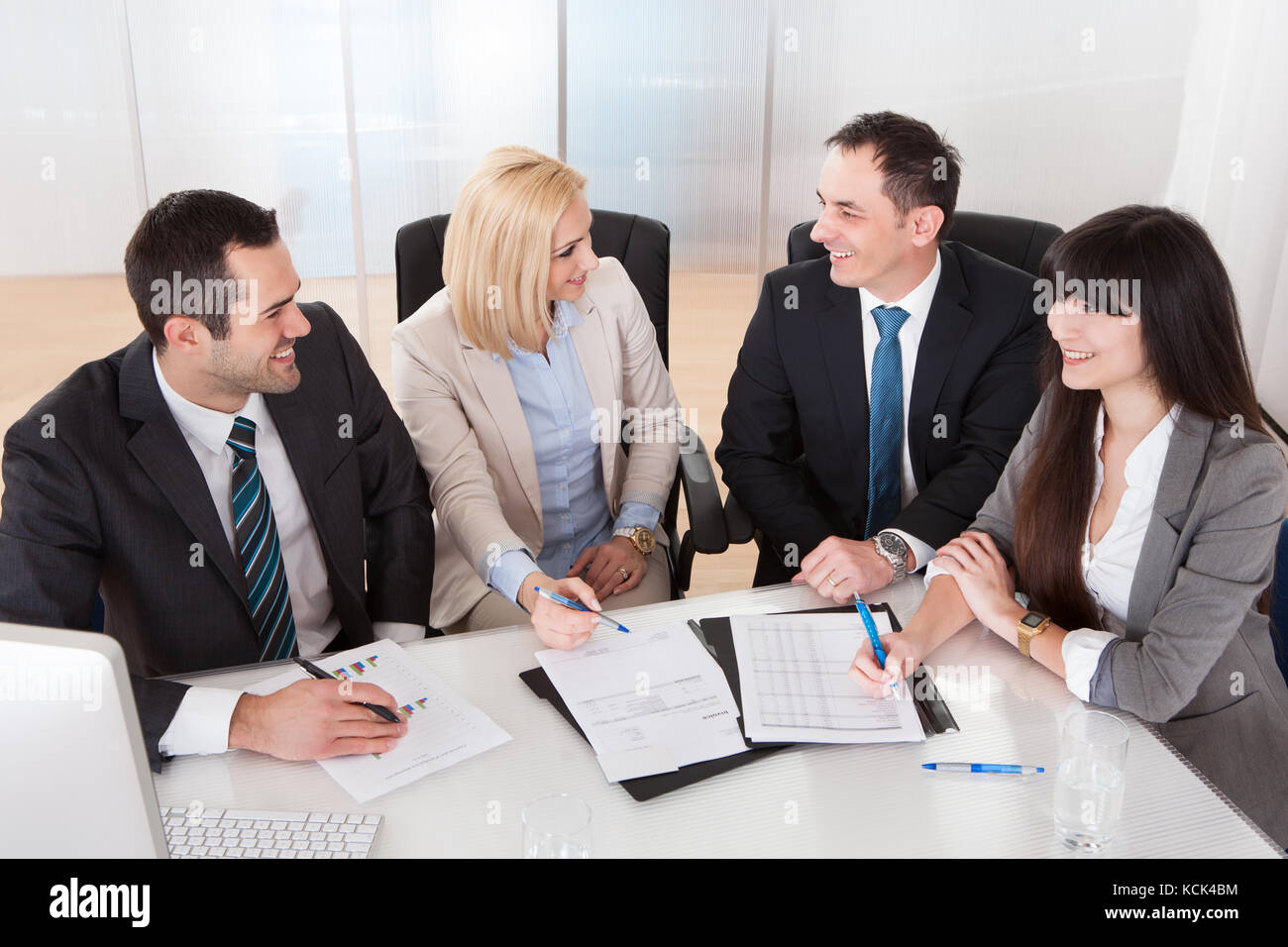 Happy Business Team In Office At The Meeting Stock Photo - Alamy