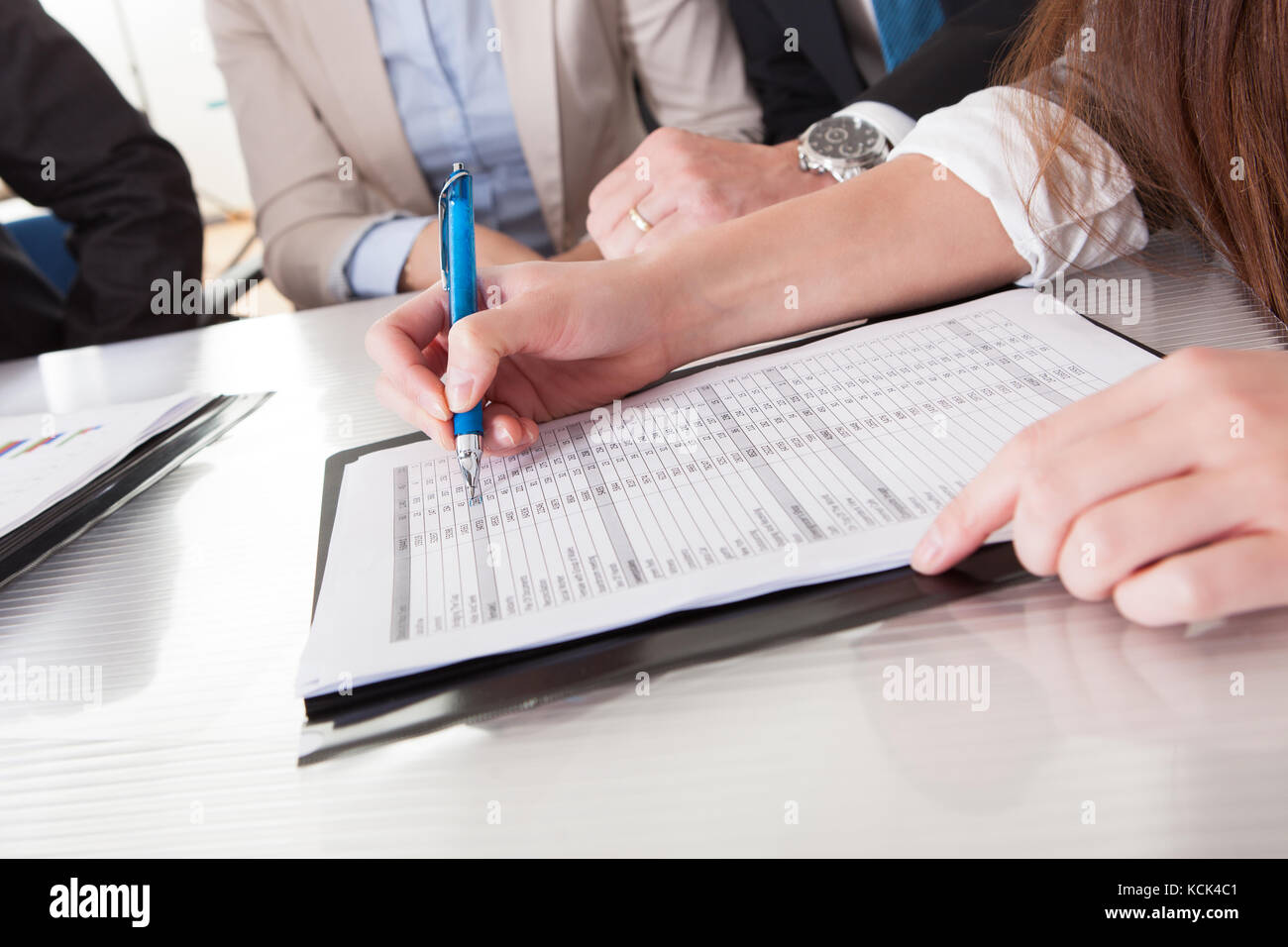 Close Up Of Business People Discussing New Project Stock Photo - Alamy