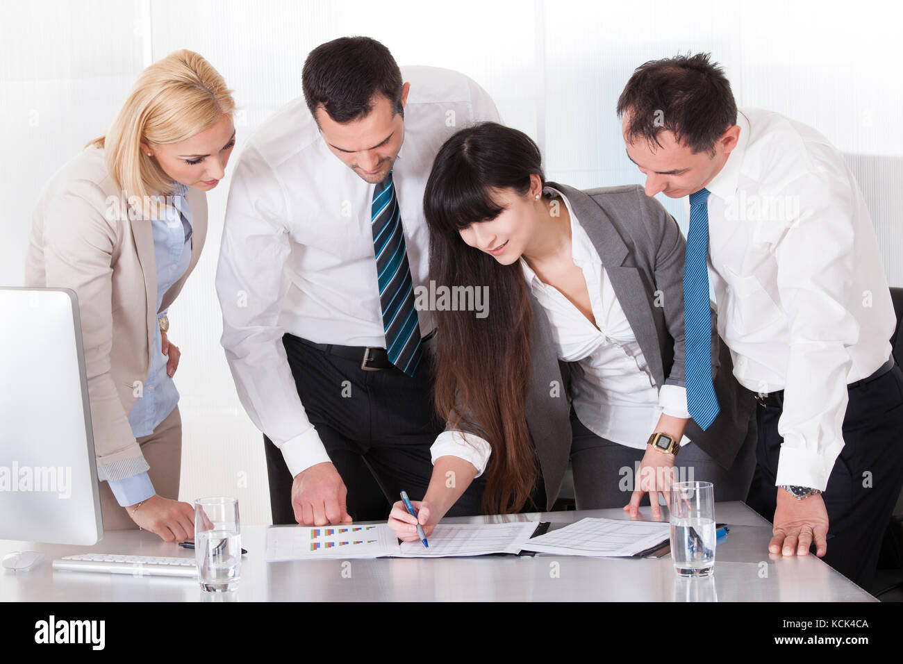 Group Of Business People Working Together In Office Stock Photo - Alamy