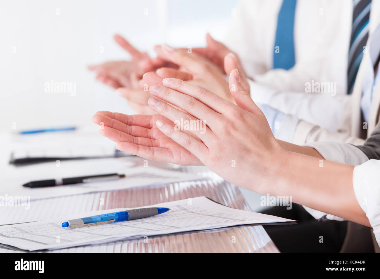 Happy Business People Clapping In The Office Stock Photo - Alamy