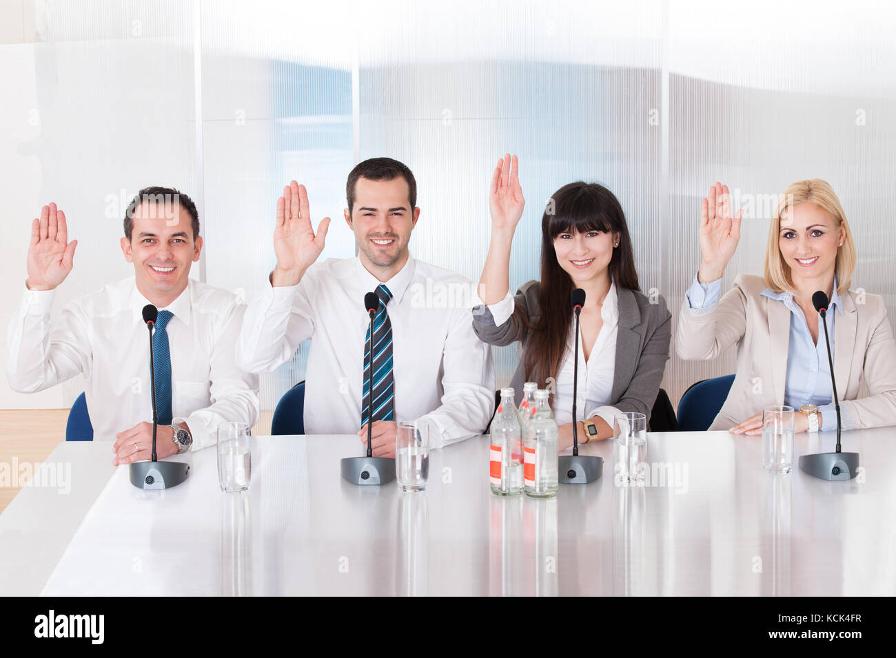 Man in suit raising hands hi-res stock photography and images - Alamy