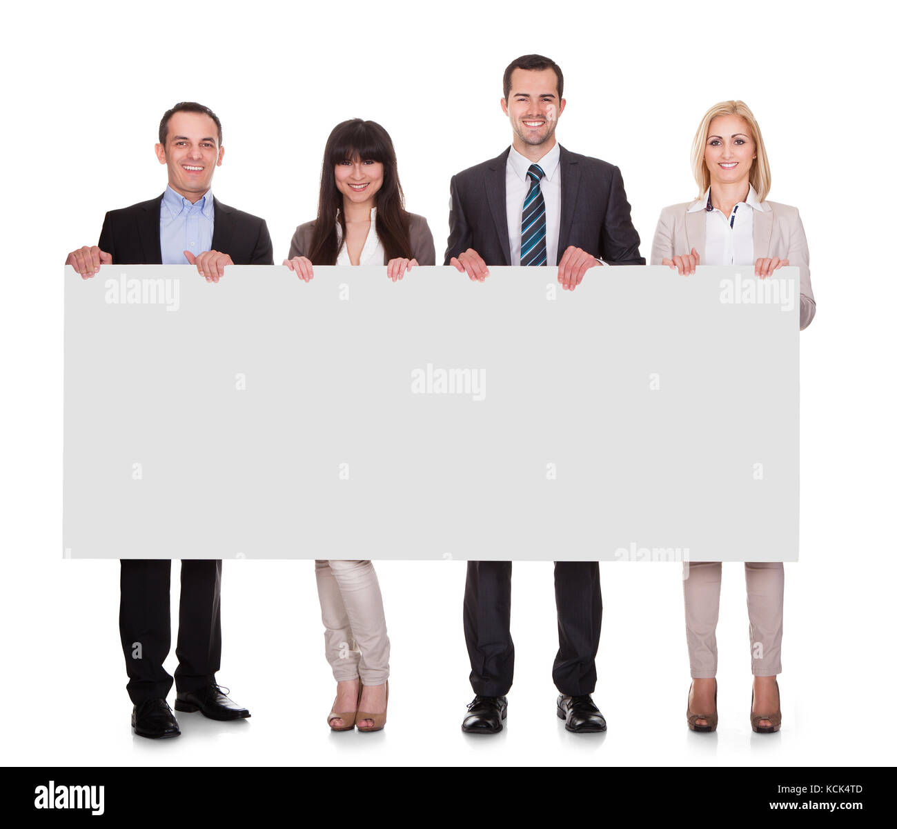 Portrait Of Happy Businesspeople Group Holding Placard Over White ...