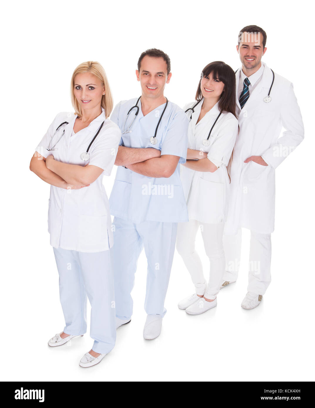 Happy Group Of Doctors Standing Over White Background Stock Photo - Alamy