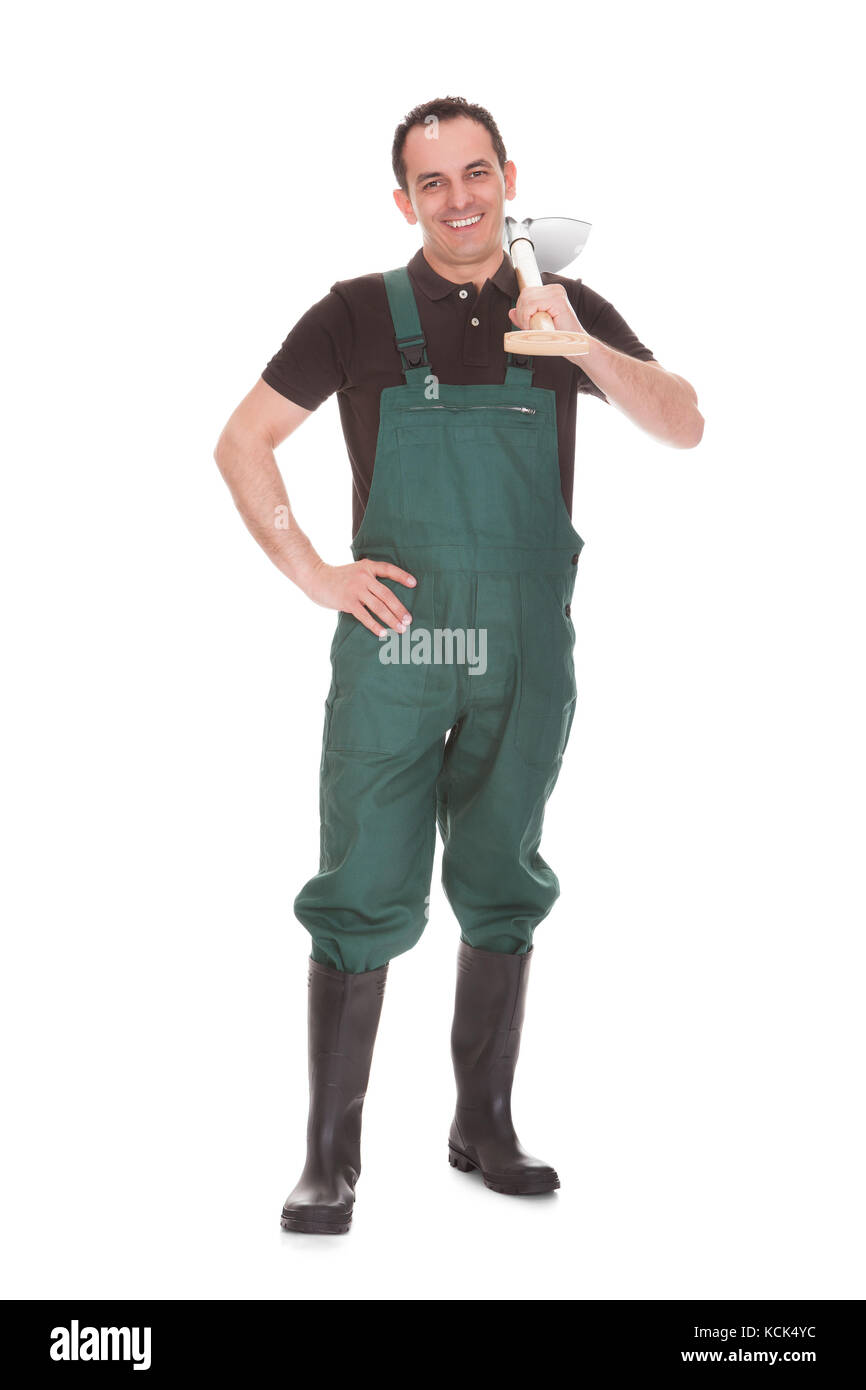 Man holding a shovel hi-res stock photography and images - Alamy