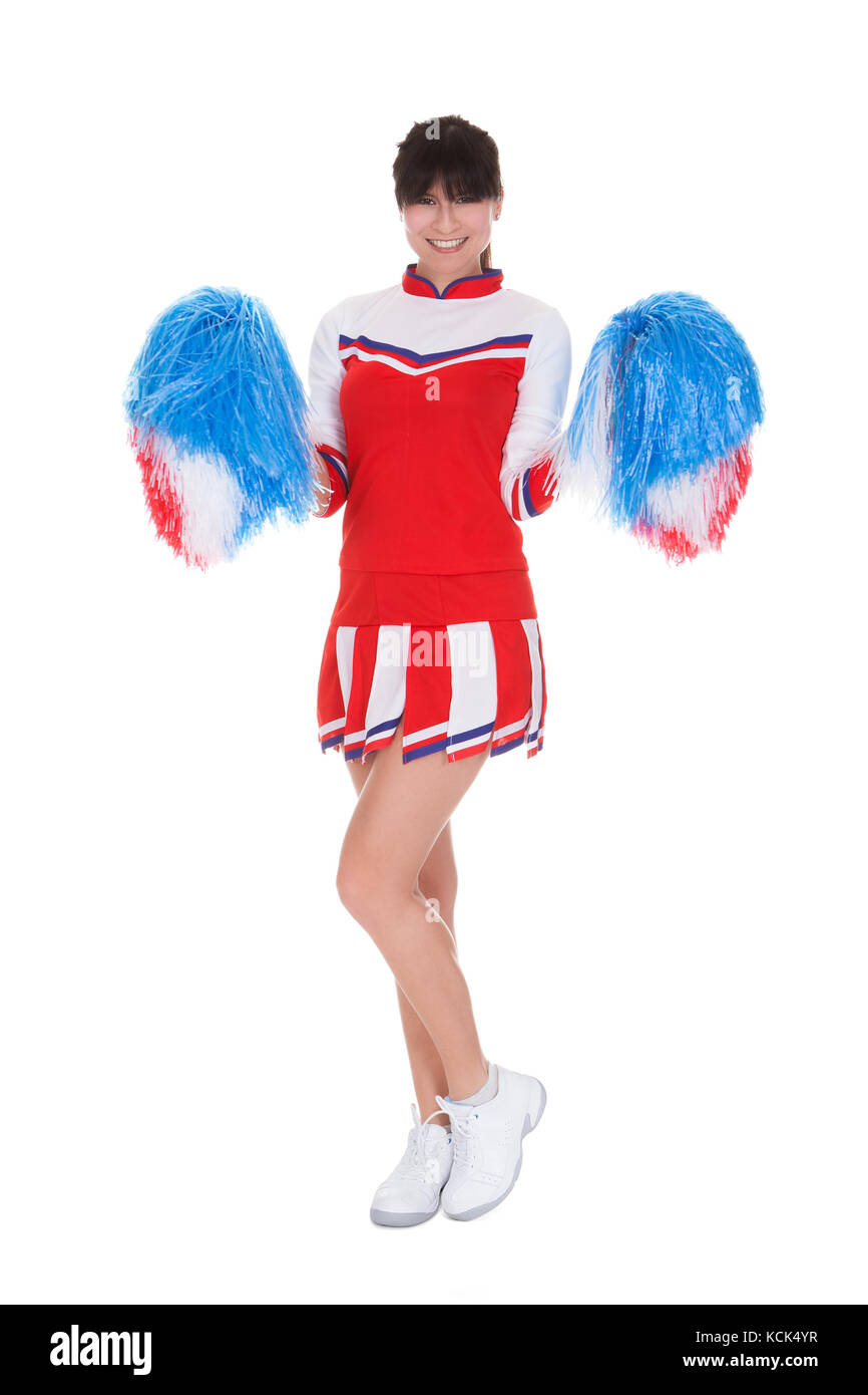 Happy Cheerleader Holding Pom-pom Over White Background Stock Photo - Alamy