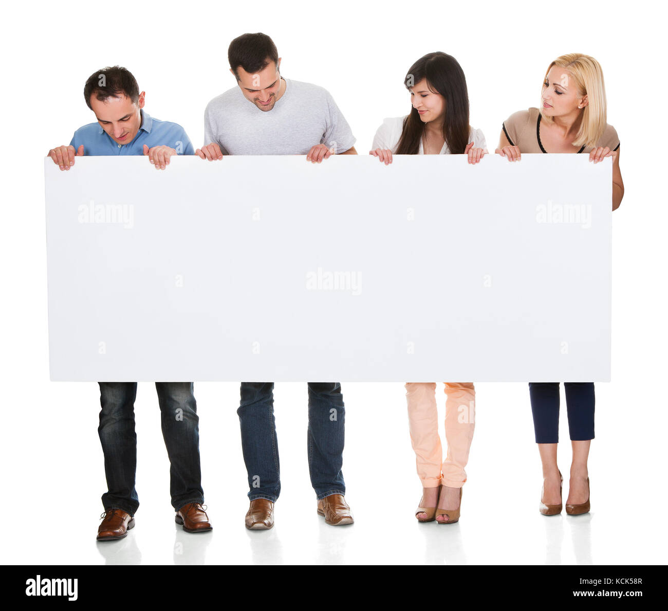 Group Of Friends Holding Placard On White Background Stock Photo - Alamy