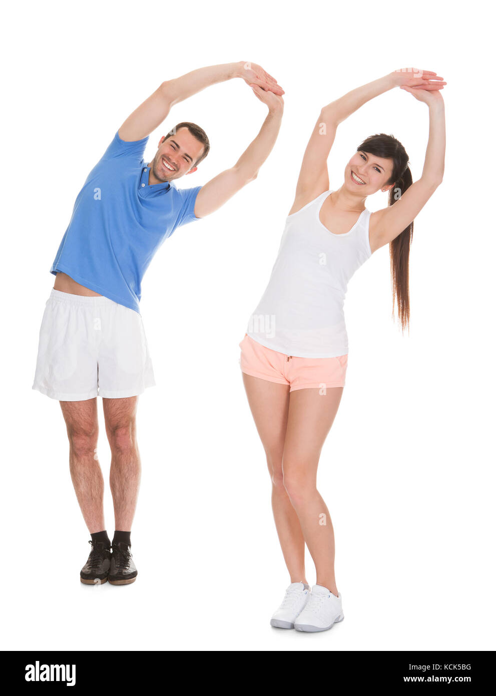 Happy Young Couple Exercising Over White Background Stock Photo - Alamy
