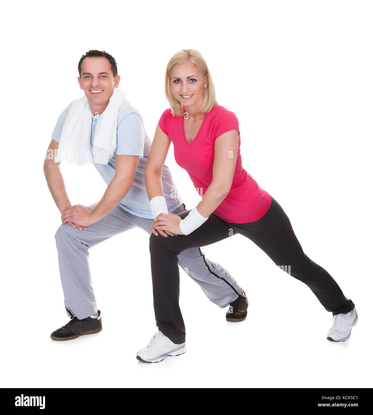 Happy Young Couple Exercising Over White Background Stock Photo - Alamy