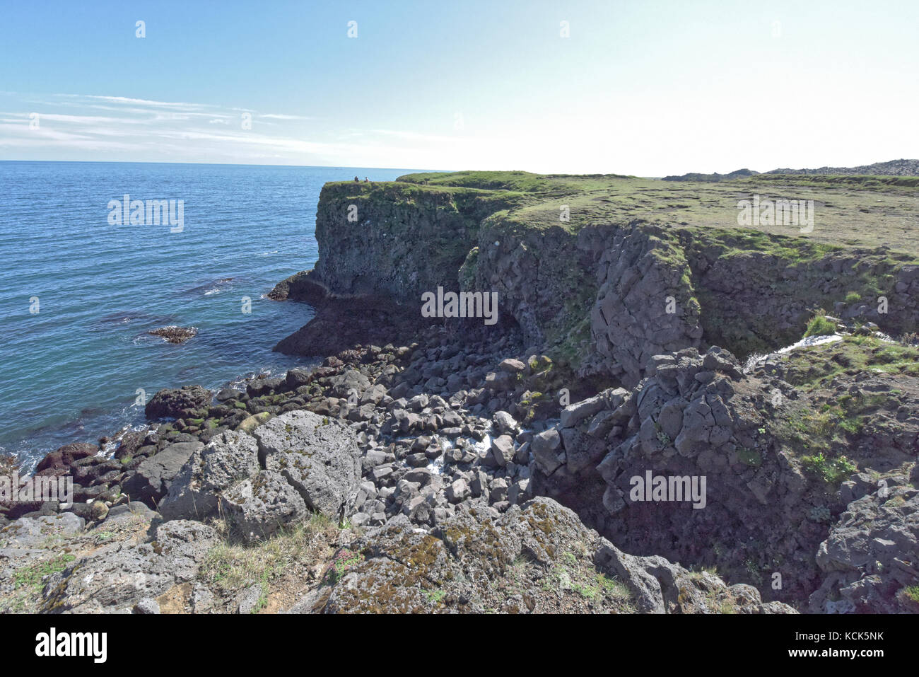 Shoreline and cliffs of basalt rock at Arnarstapi nature reserve seen ...