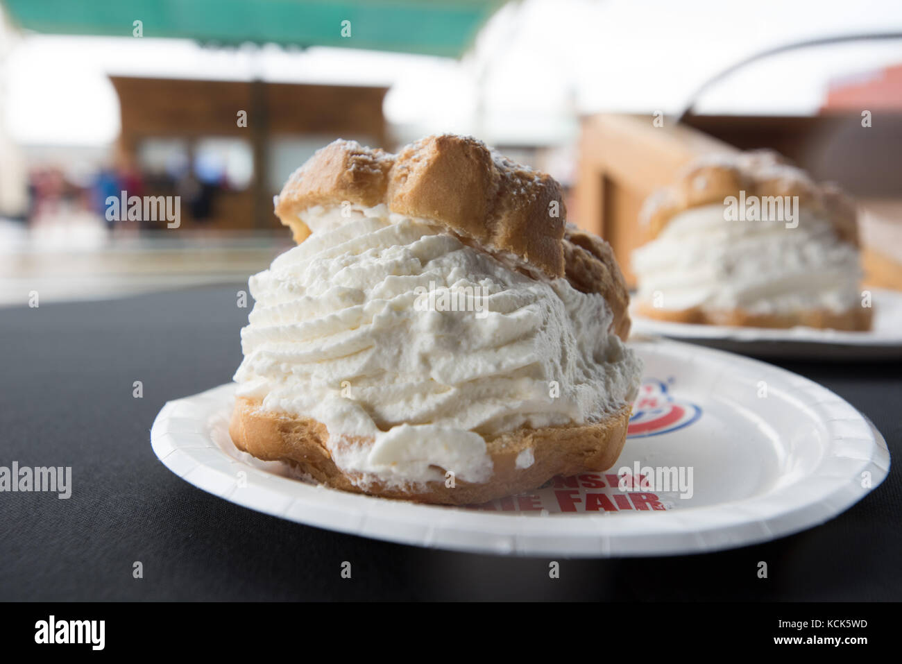A whipped cream puff pastry dessert is prepared during the Wisconsin ...