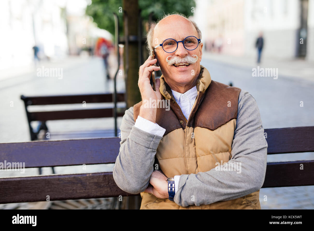 technology, senior people, and communication concept - happy old man ...