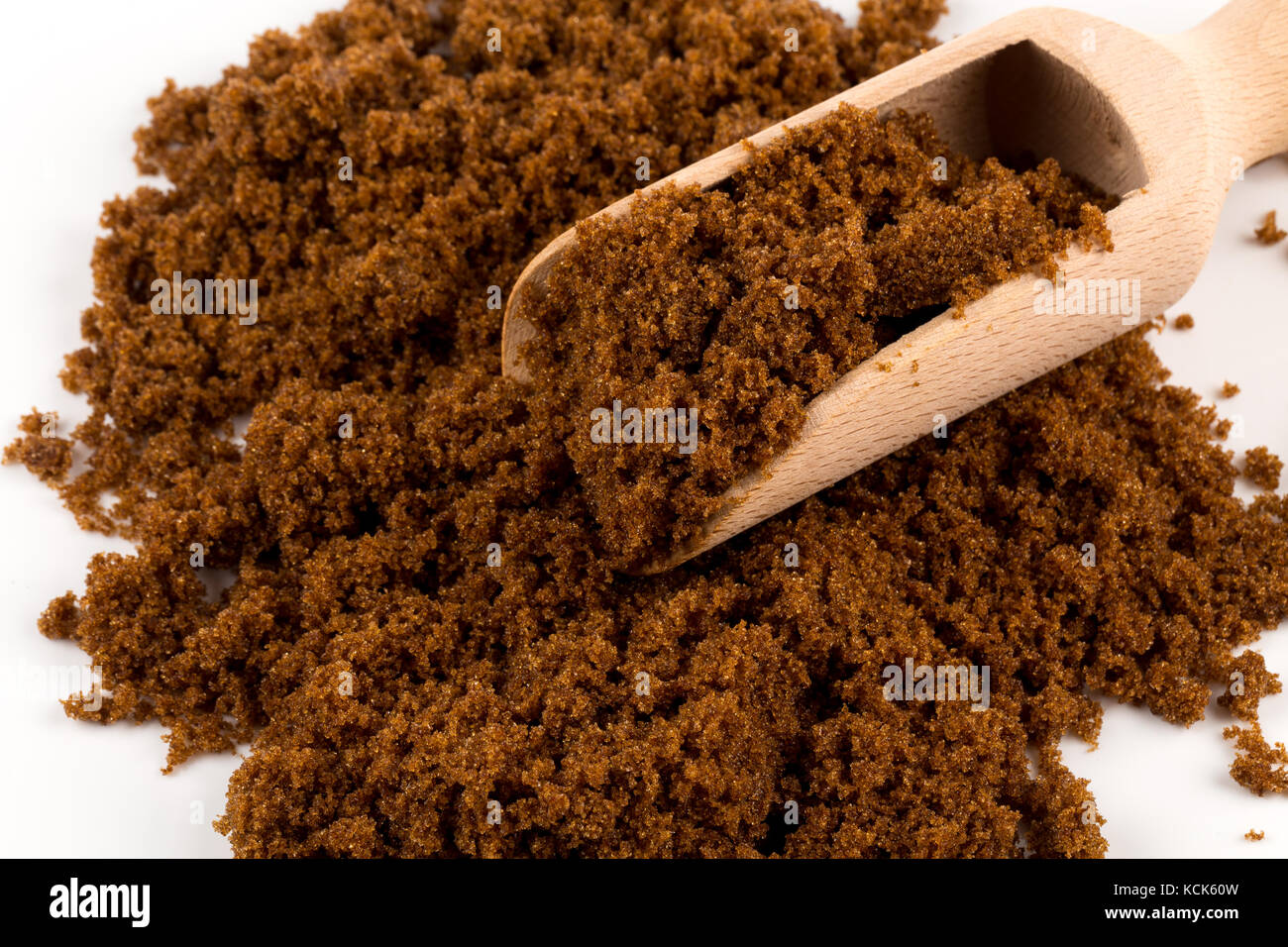 brown muscovado sugar in scoop isolated on white background Stock Photo ...