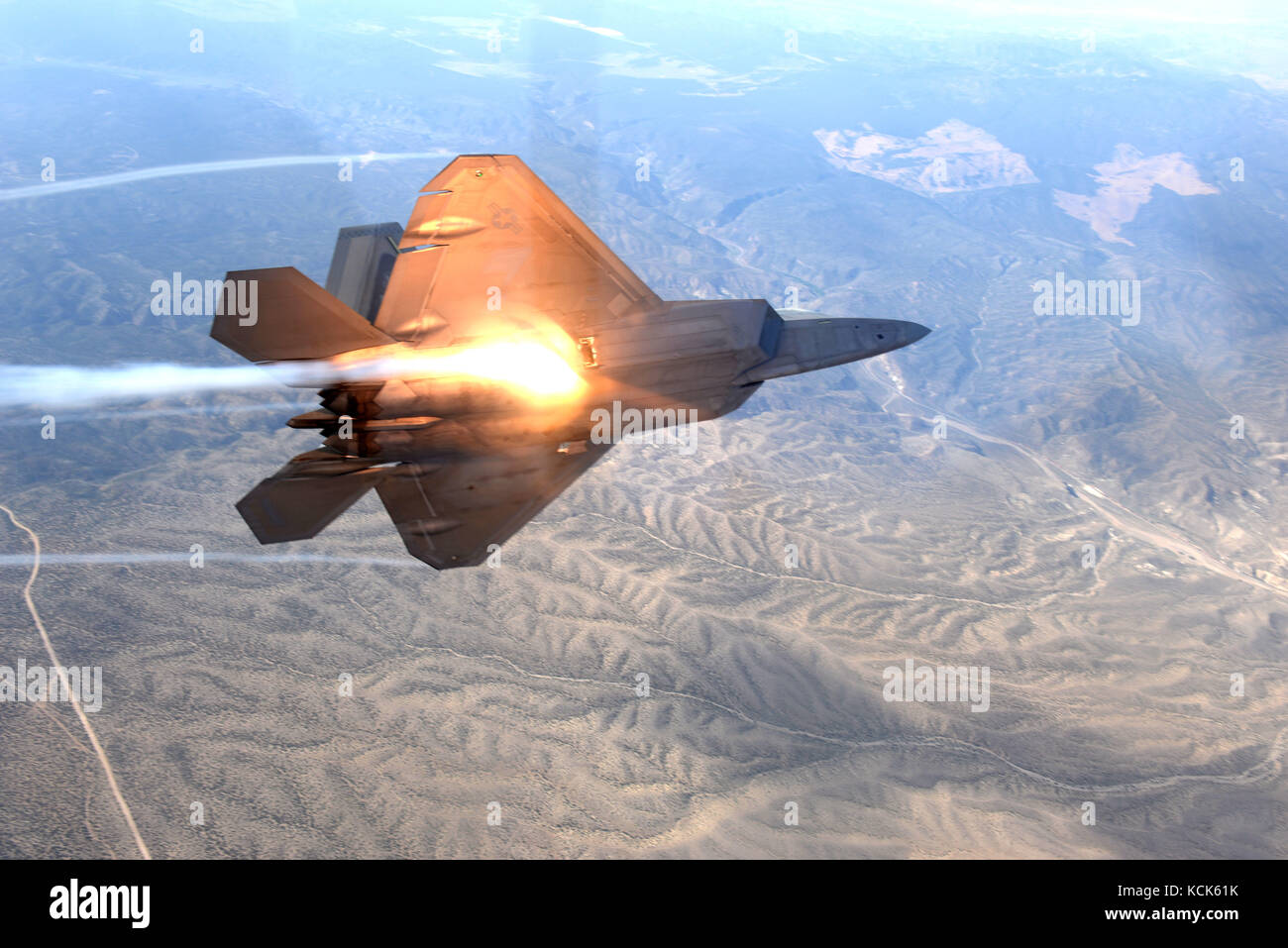 A U.S. Air Force F-22 Raptor stealth tactical fighter aircraft flies ...