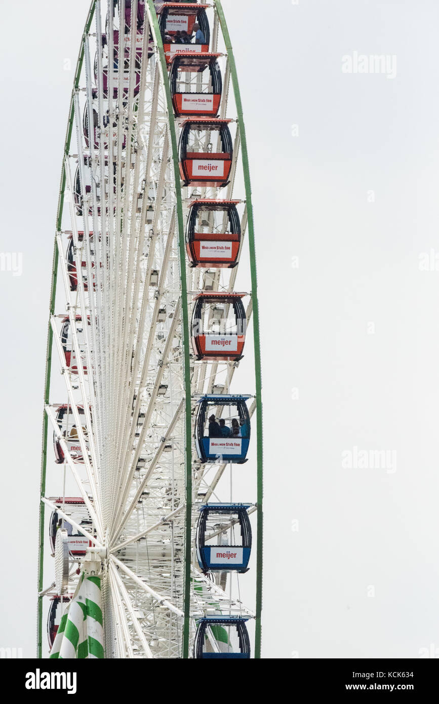 Visitors ride the ferris wheel during the Wisconsin State Fair at the ...