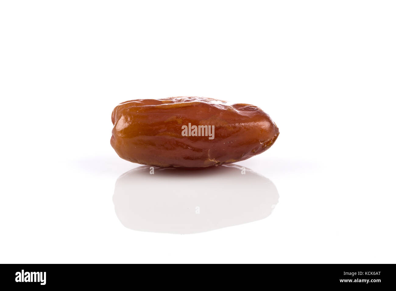 Date fruit close up isolated on a white background Stock Photo - Alamy