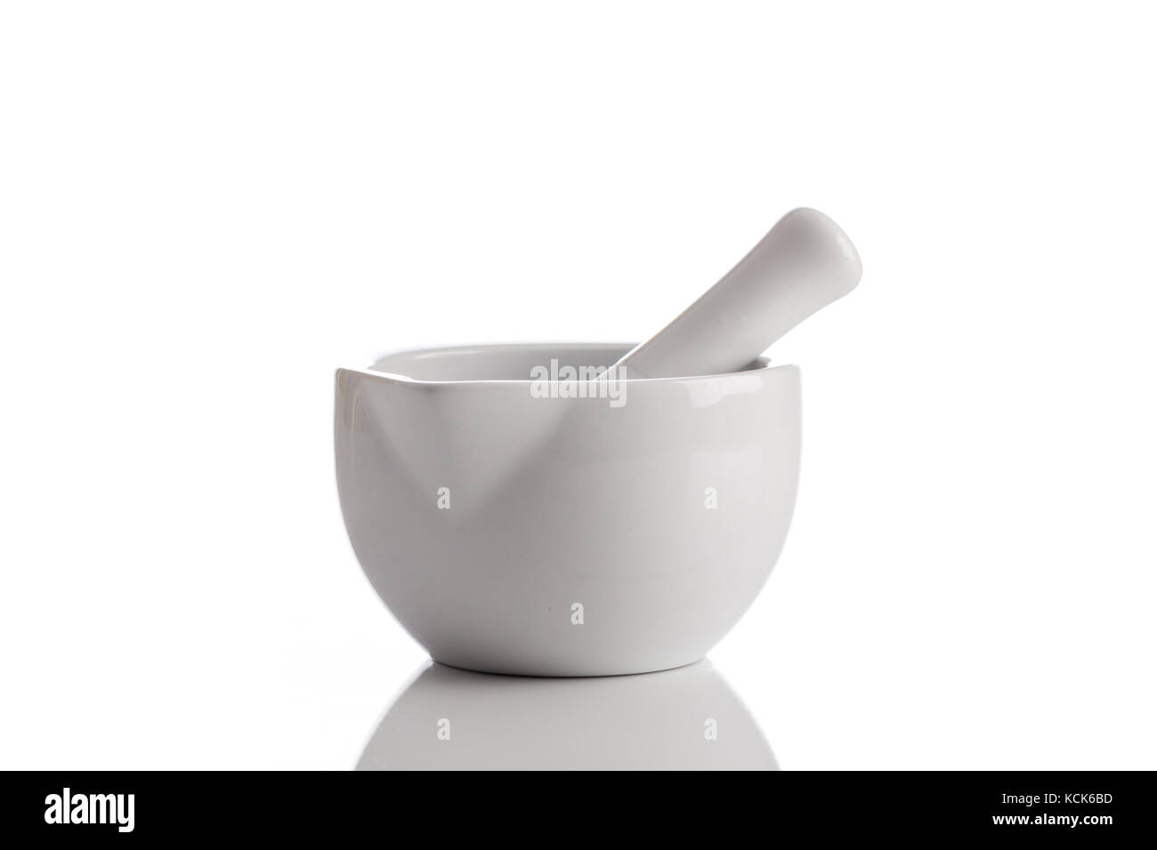 Ceramic mortar and pestle on a white background Stock Photo - Alamy