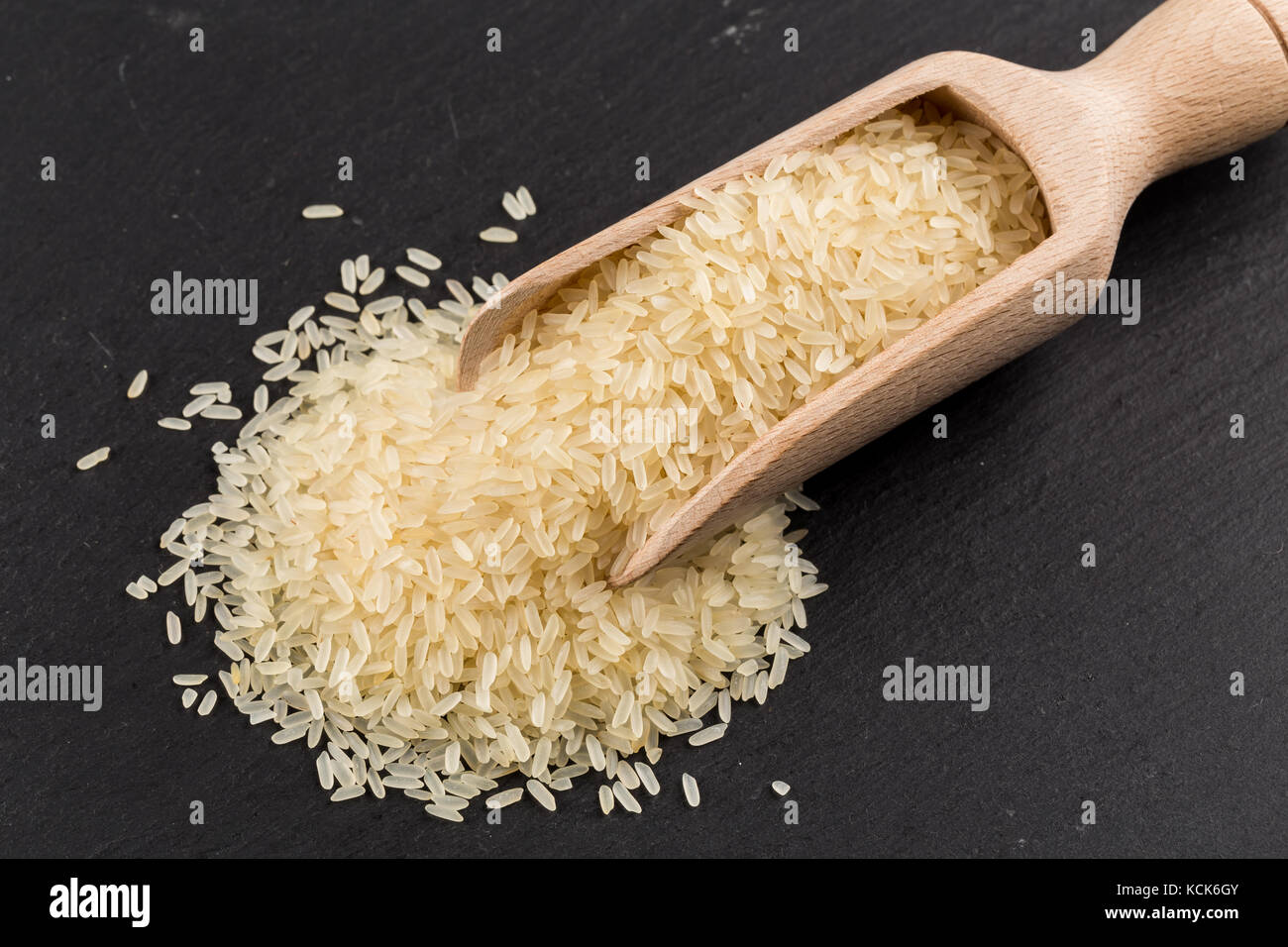 Scoop of rice on puffed rice cereal background close up Stock Photo - Alamy