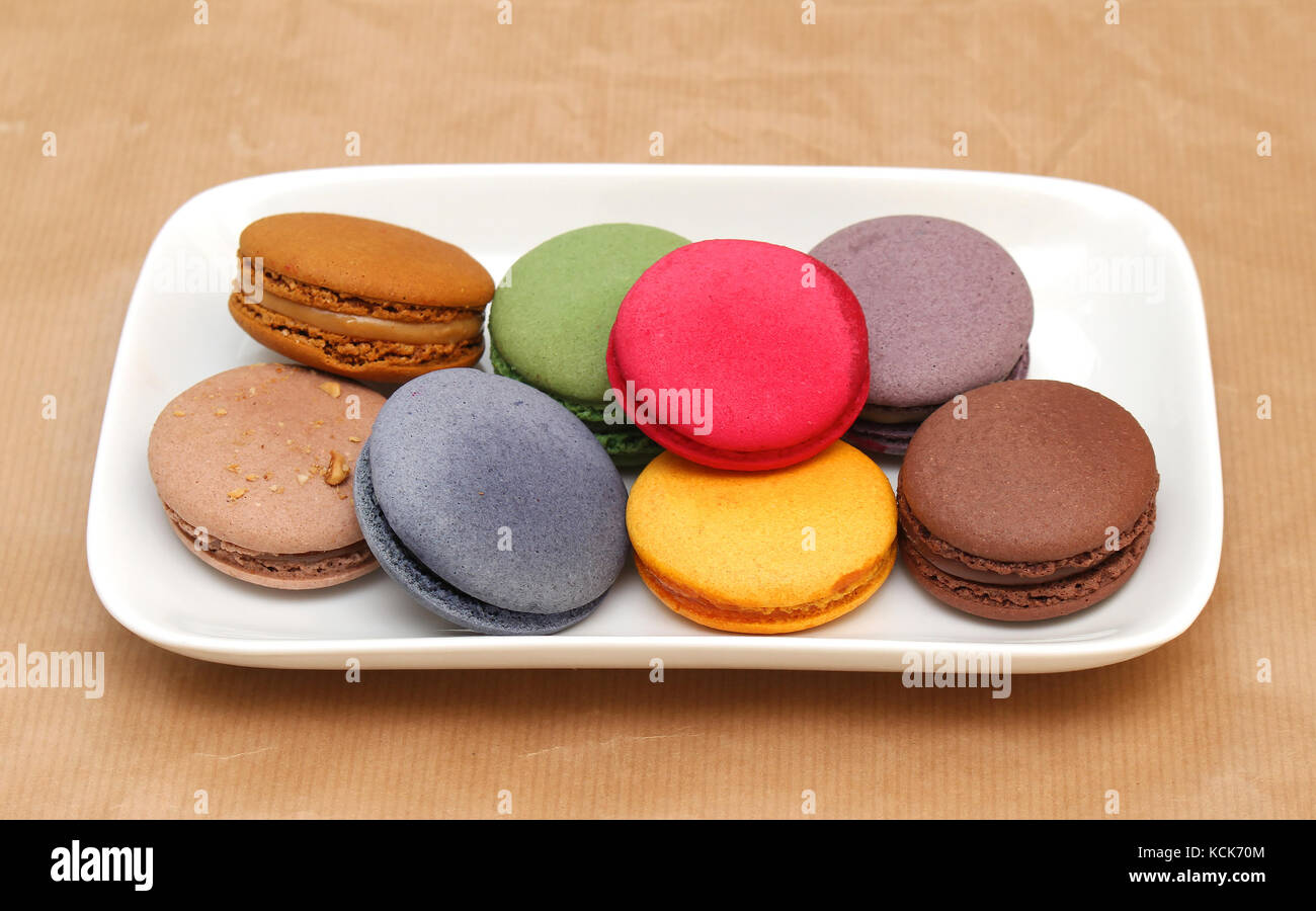 Sweet colorful macaroons pile on ceramic plate Stock Photo - Alamy