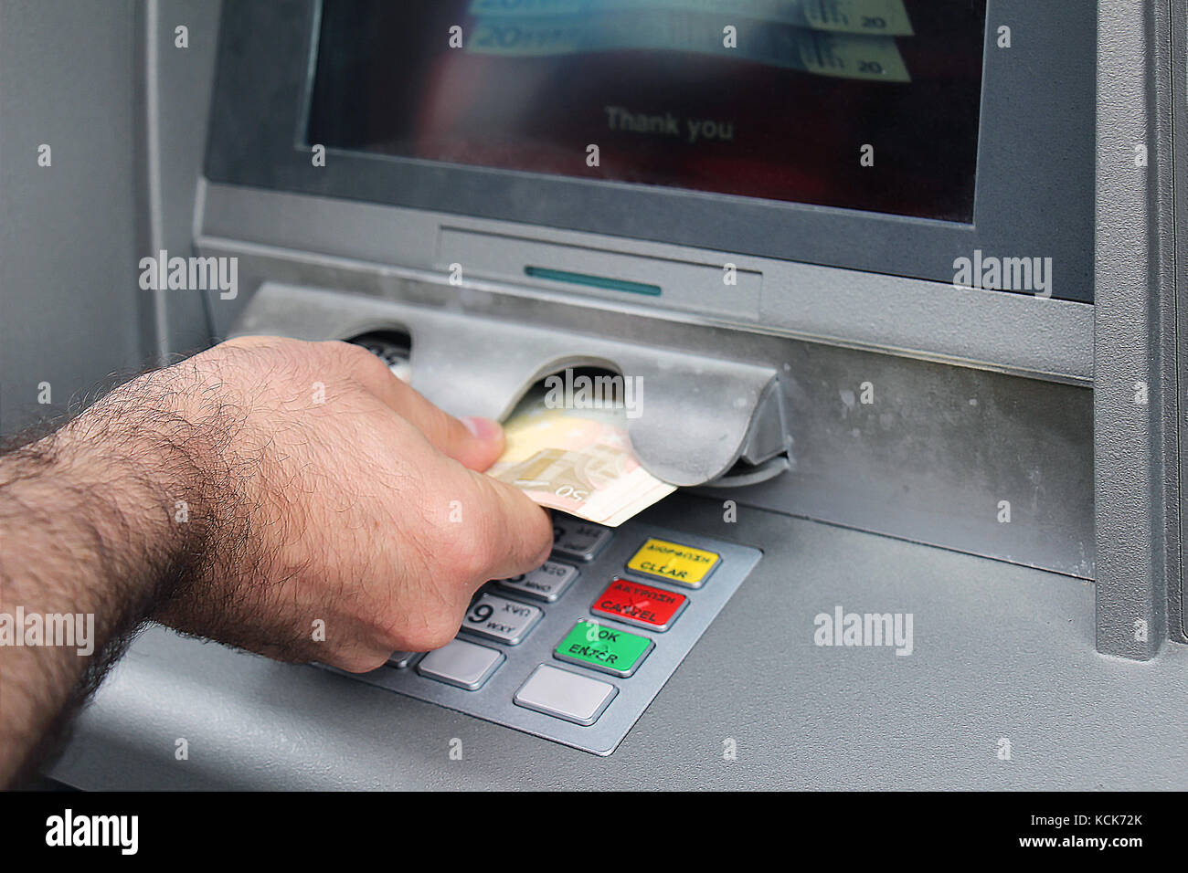 Male hand taking money from cash machine Stock Photo - Alamy
