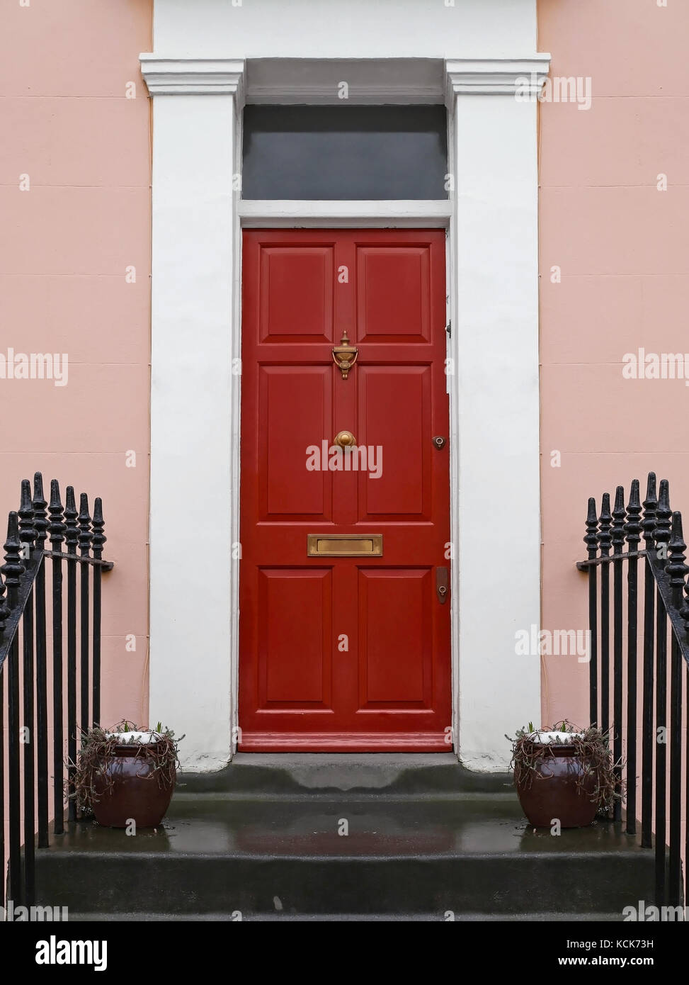 Red entrance front door on old house Stock Photo - Alamy