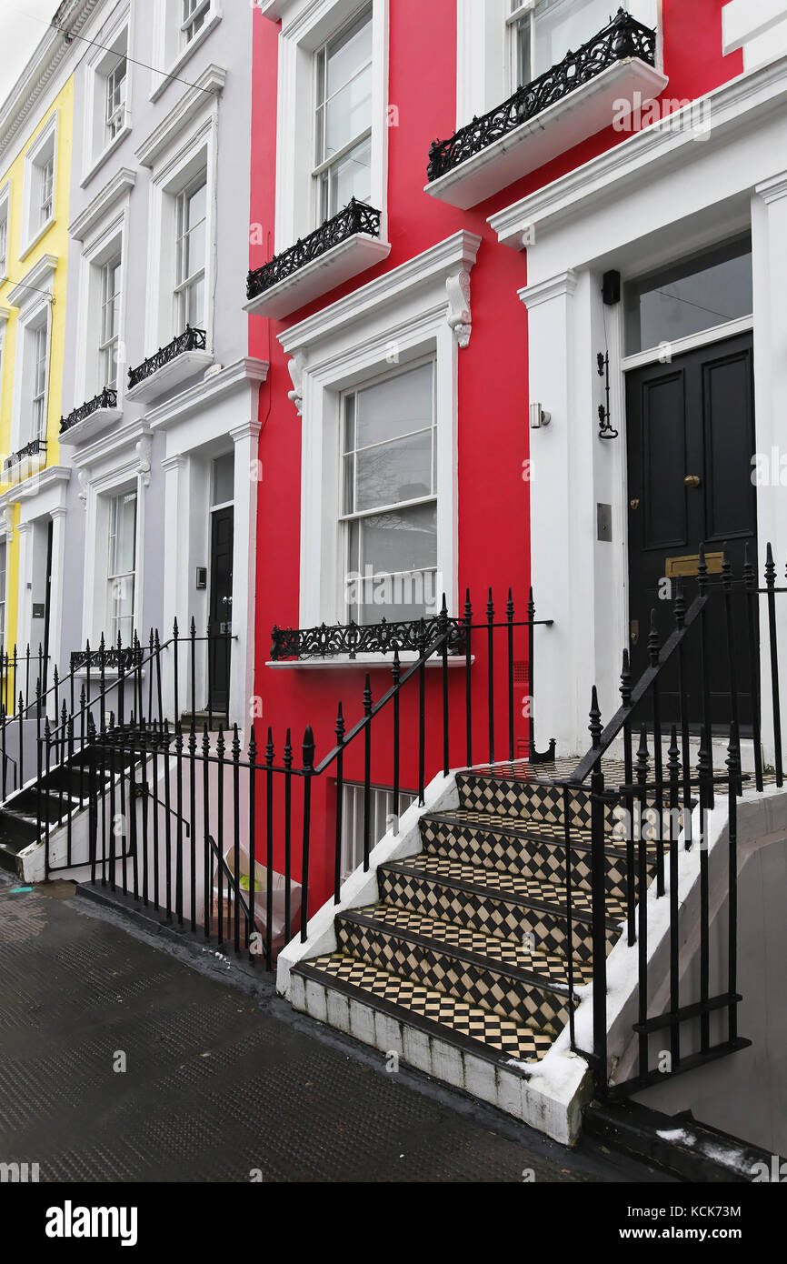 Row of retro houses with colorful facades Stock Photo - Alamy