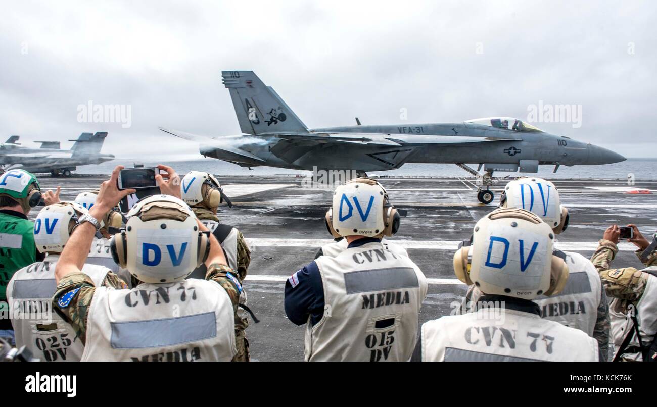 Military representatives observe flight operations aboard the U.S. Navy ...