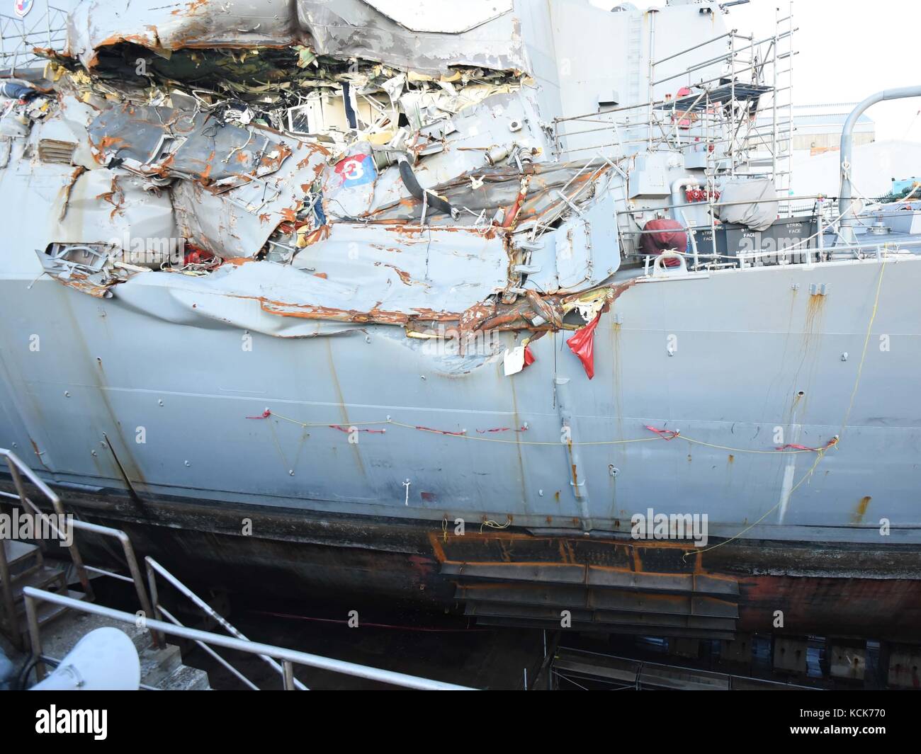 U.S. sailors repair the U.S. Navy Arleigh Burke-class guided-missile ...