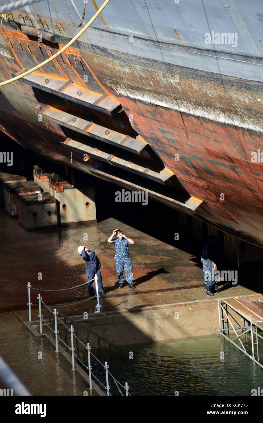 U.S. sailors repair the U.S. Navy Arleigh Burke-class guided-missile ...