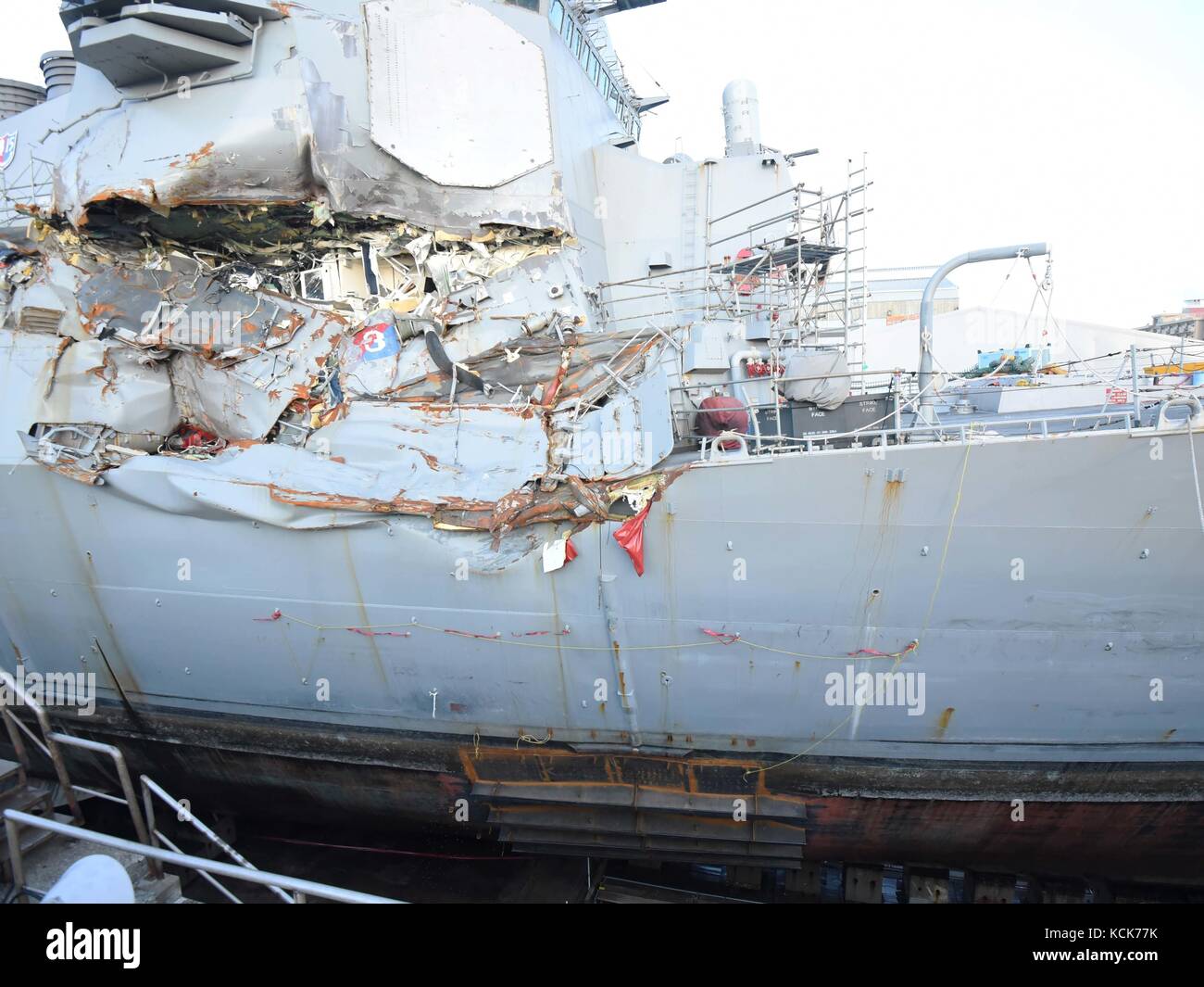 U.S. sailors repair the U.S. Navy Arleigh Burke-class guided-missile ...